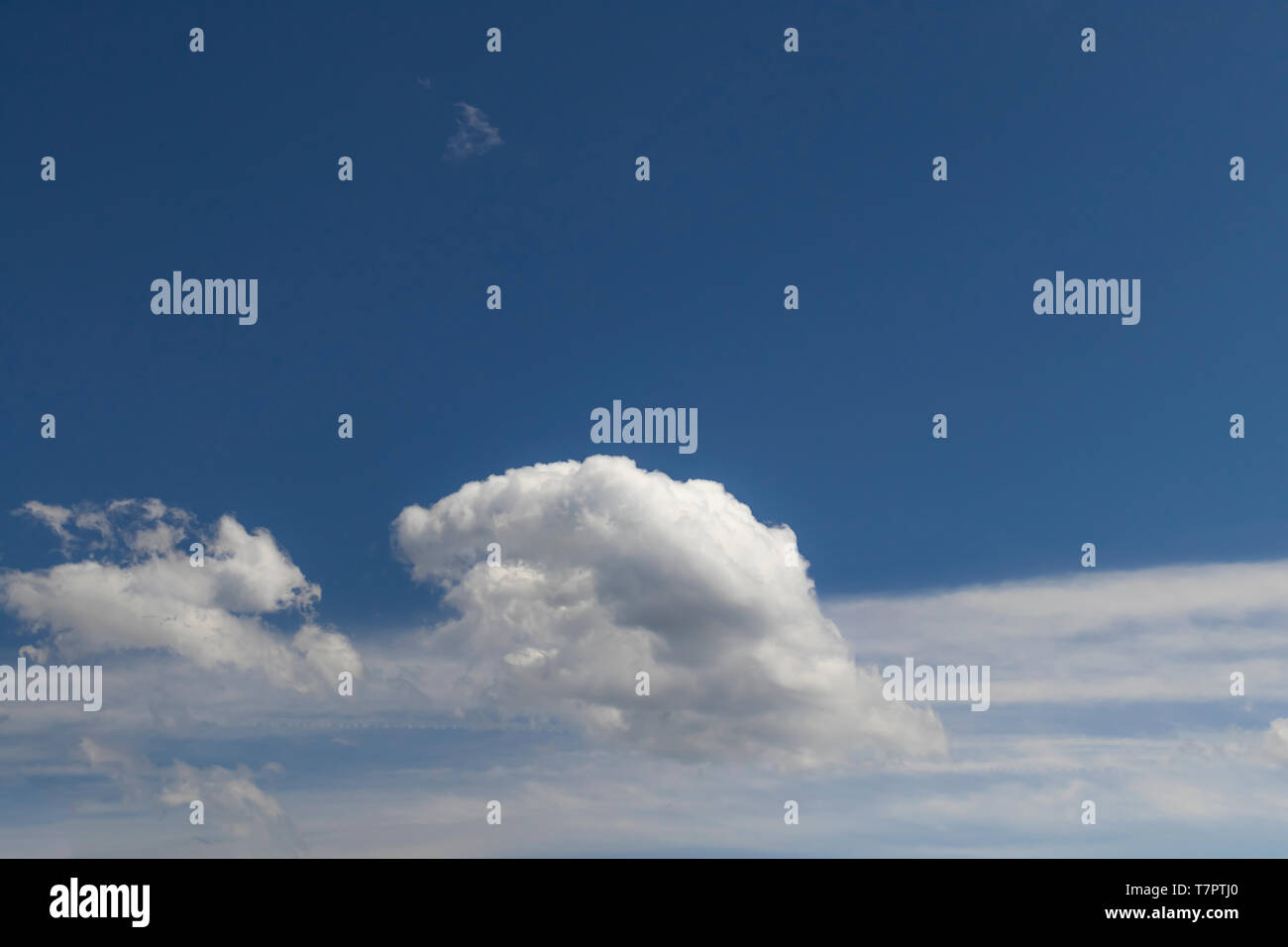 Colorful volumetric clouds on a bright sky. Optimistic look. Free space ...