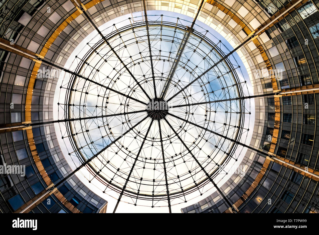 Round building with suspended transparent outdoor ceiling reflected the ...