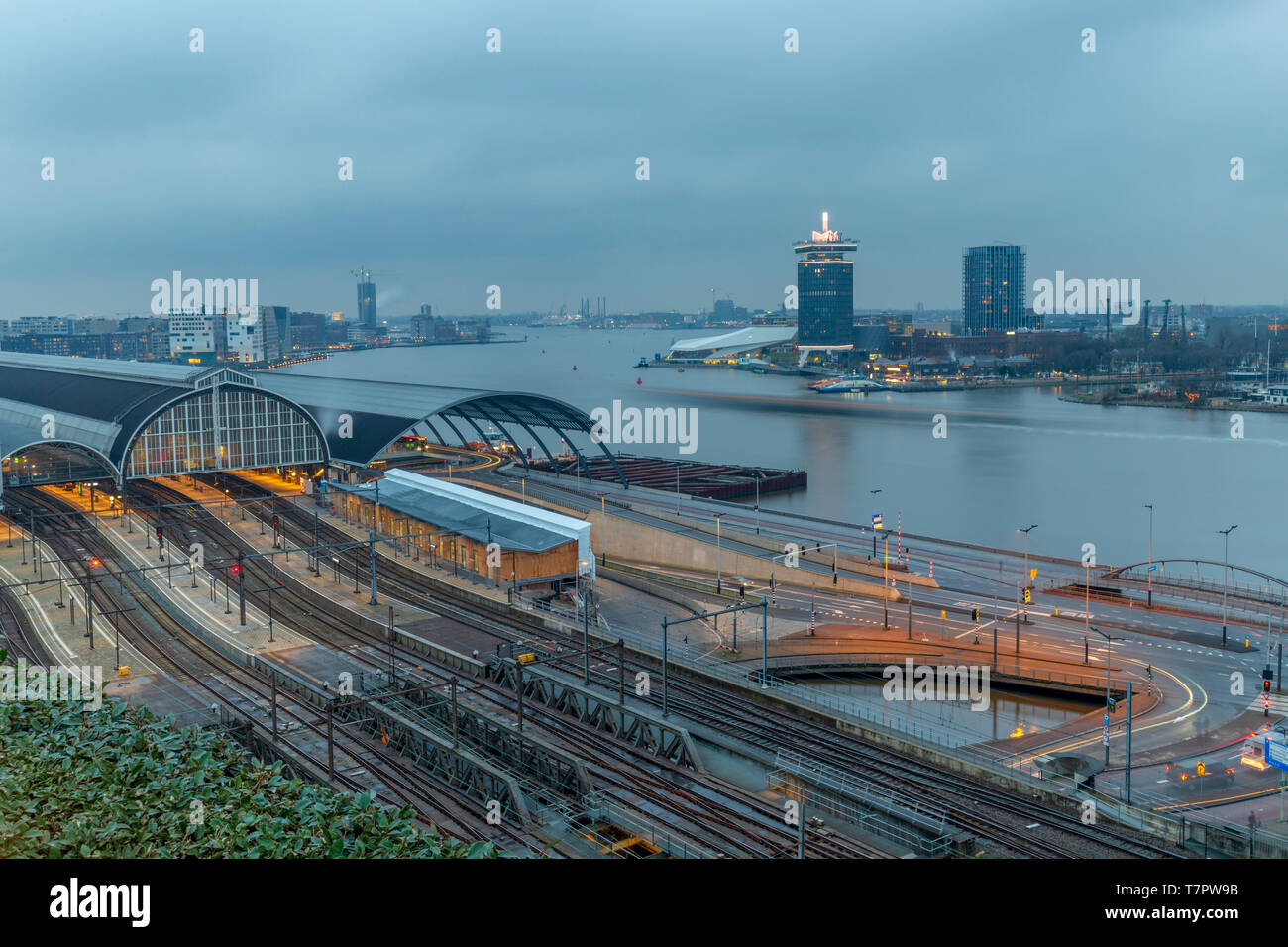 Aerial view of the train station at the edge of the big river in the ...