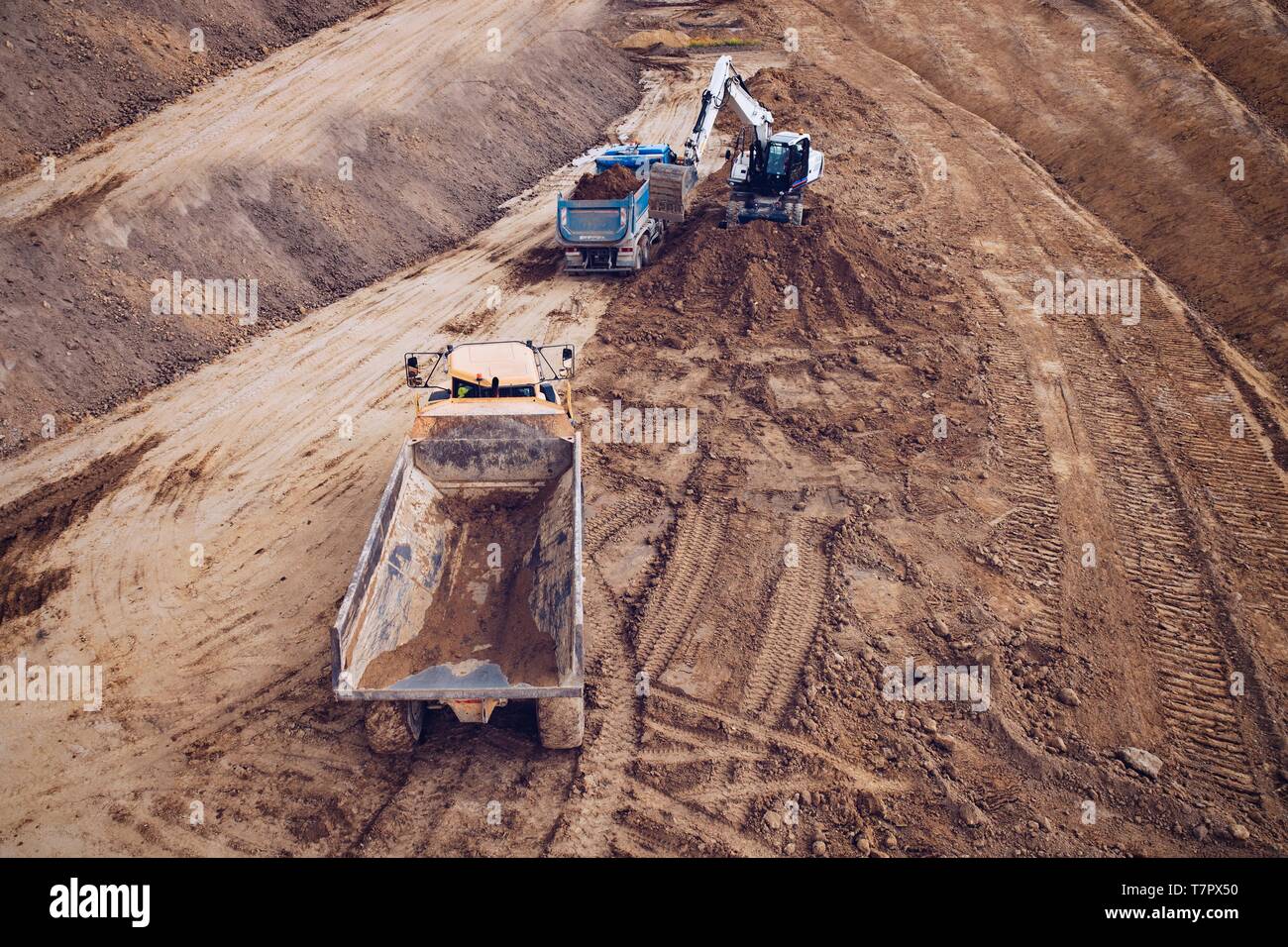 Aerial drone view on excavator loading sand on tipper truck. Road ...