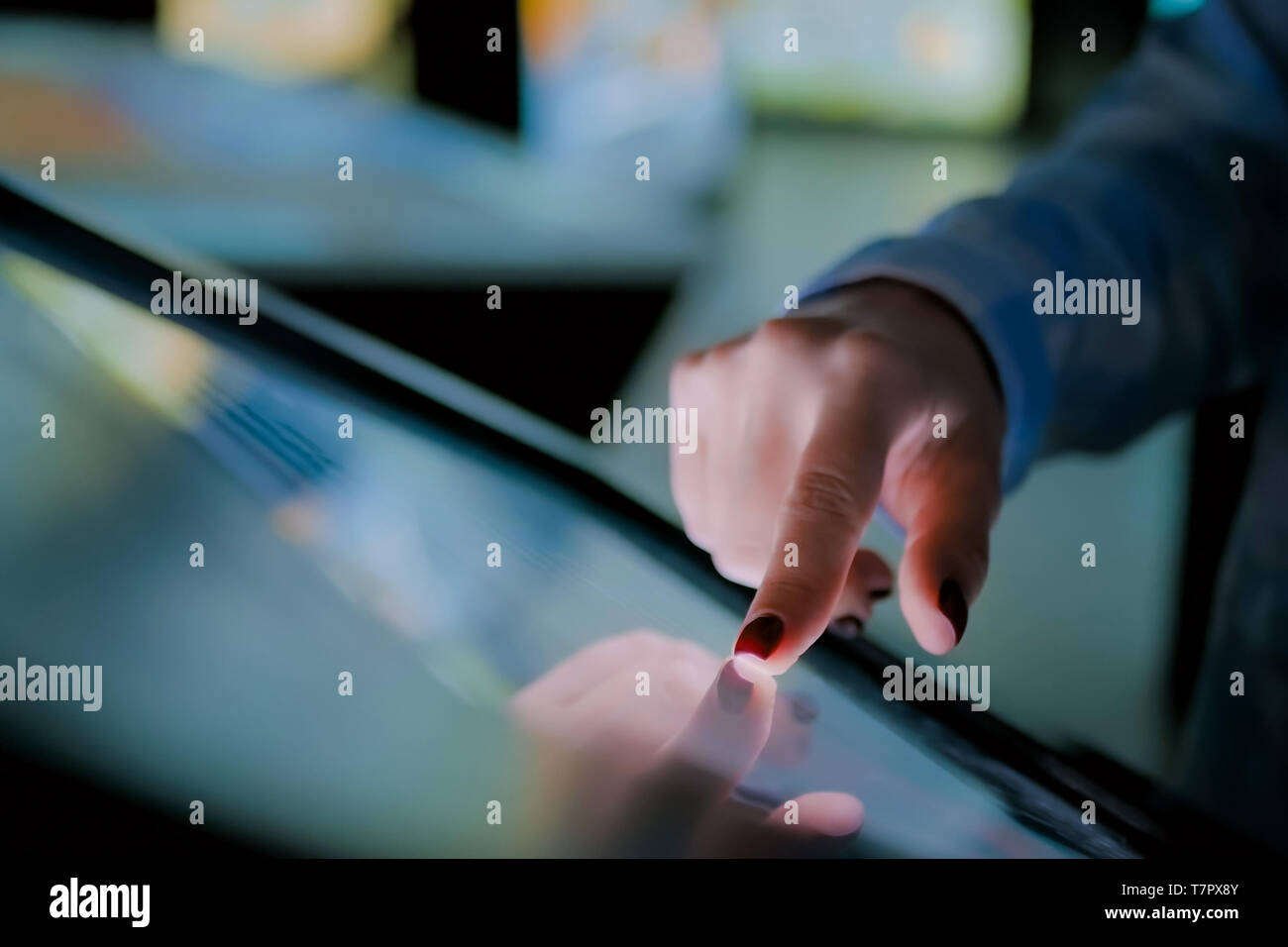Woman using multimedia touchscreen display of interactive kiosk Stock ...