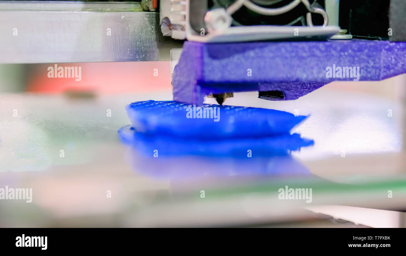 Automatic 3D printer machine working at modern technology exhibition ...