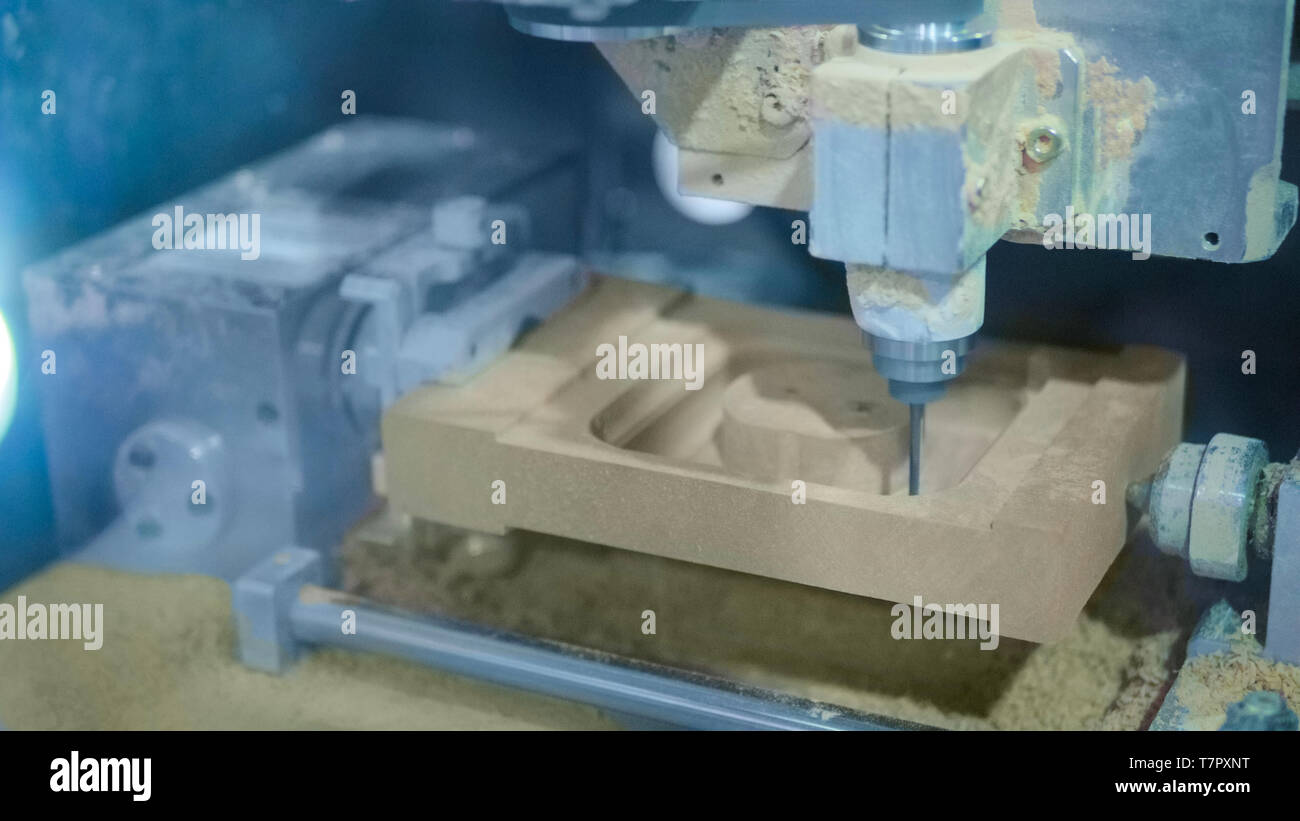 CNC engraving milling machine during work Stock Photo - Alamy