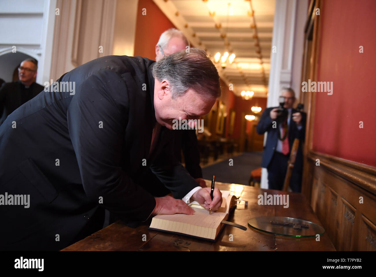 US Secretary of State Mike Pompeo signs a guest book as he arrives to ...