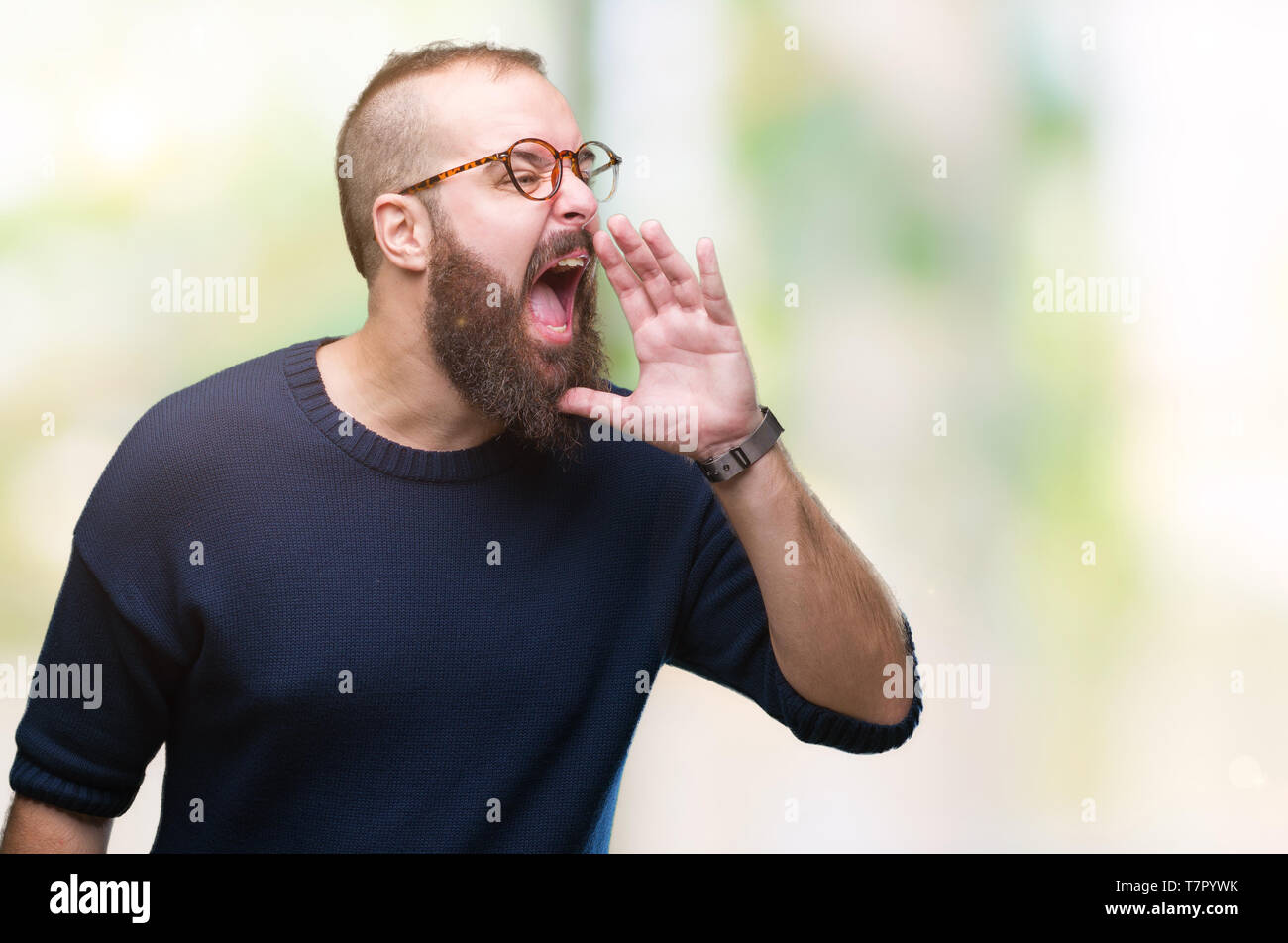 Young caucasian hipster man wearing sunglasses over isolated background ...