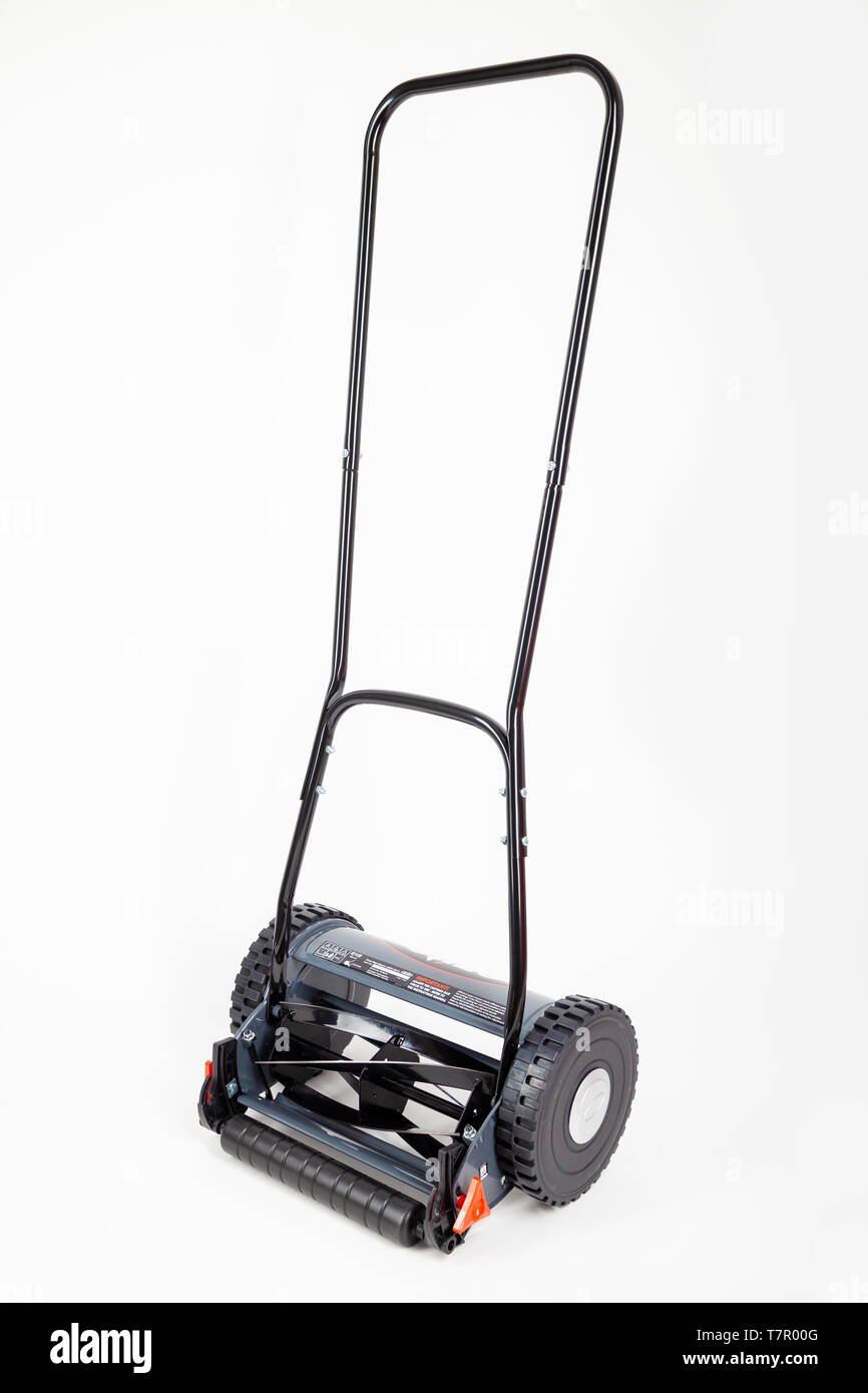 A push lawn mower photographed in a studio against a white background ...