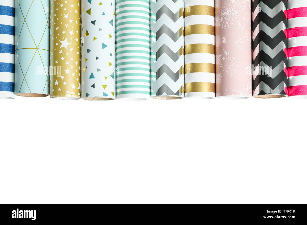 Rolls of festive wrapping paper on white background. Space for text ...