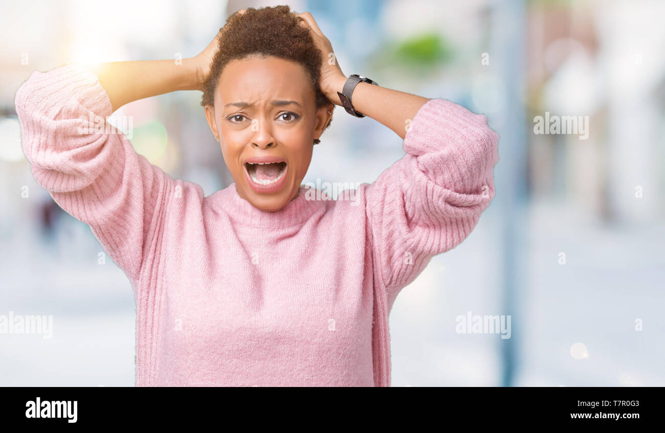 Beautiful young african american woman over isolated background Crazy ...