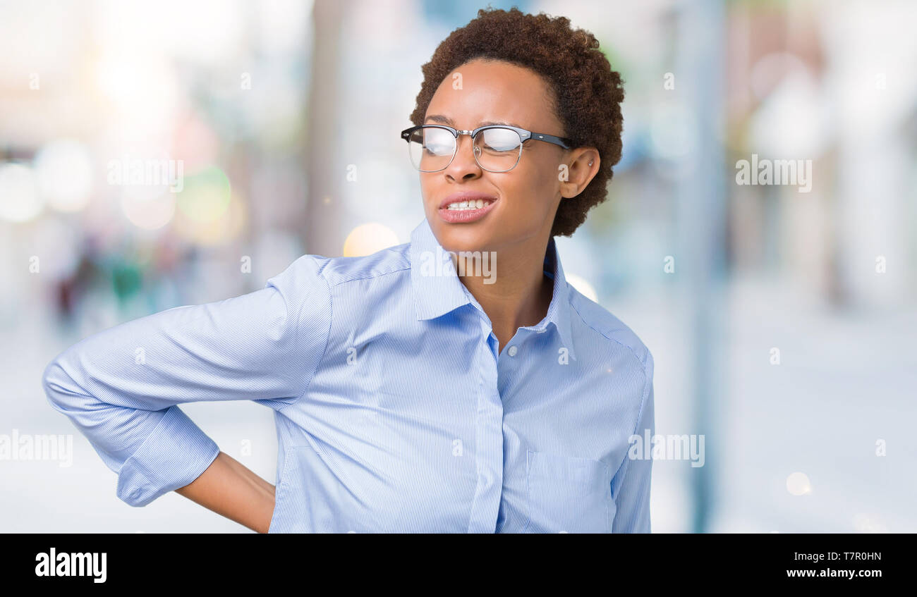 Young beautiful african american business woman over isolated ...