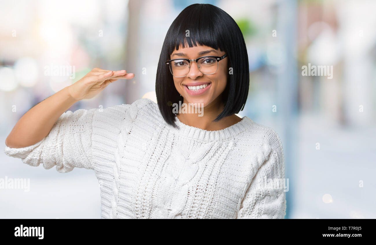 Beautiful young african american woman wearing glasses over isolated ...