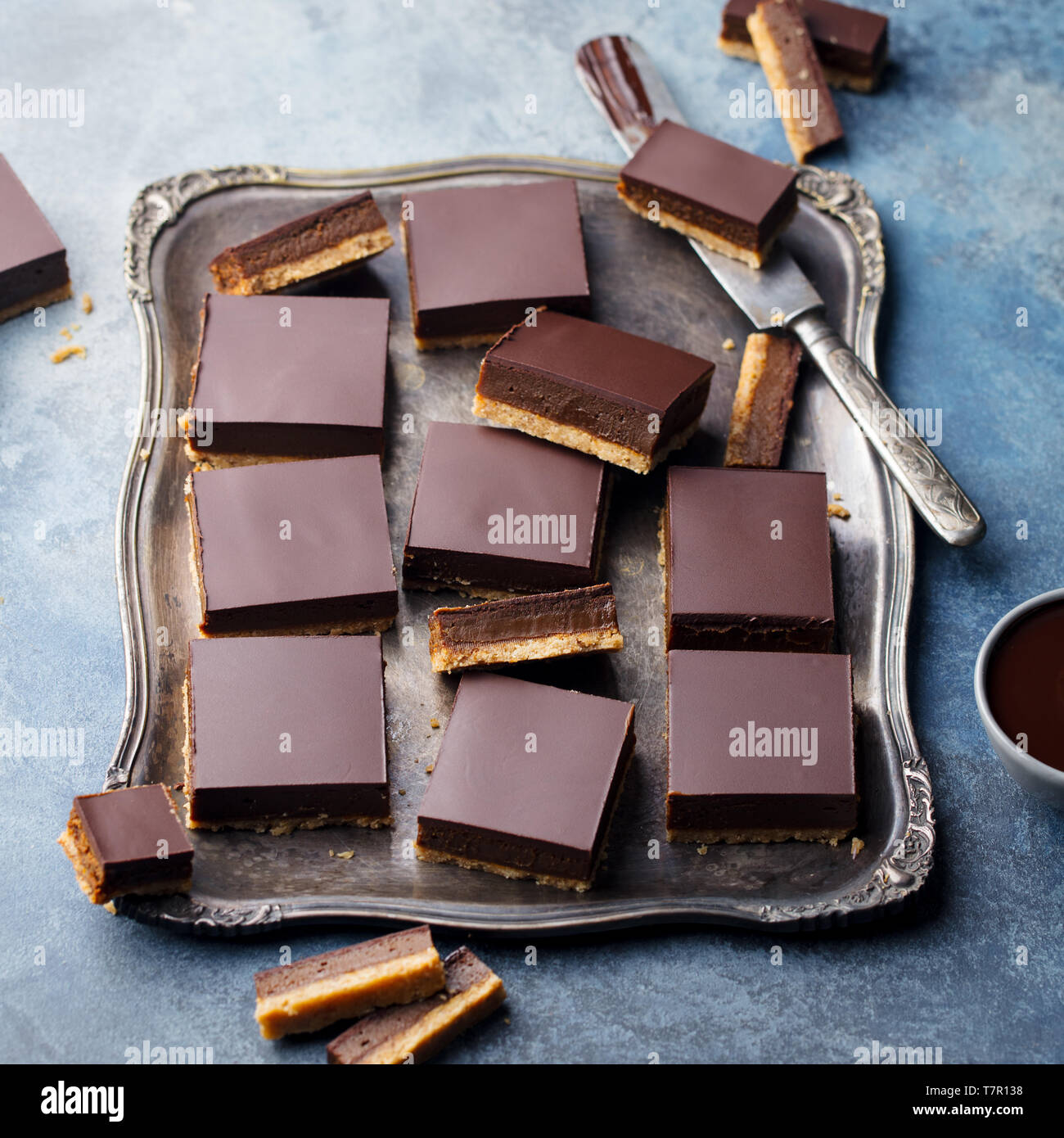 Chocolate caramel slices, bars, millionaires shortbread on a vintage ...