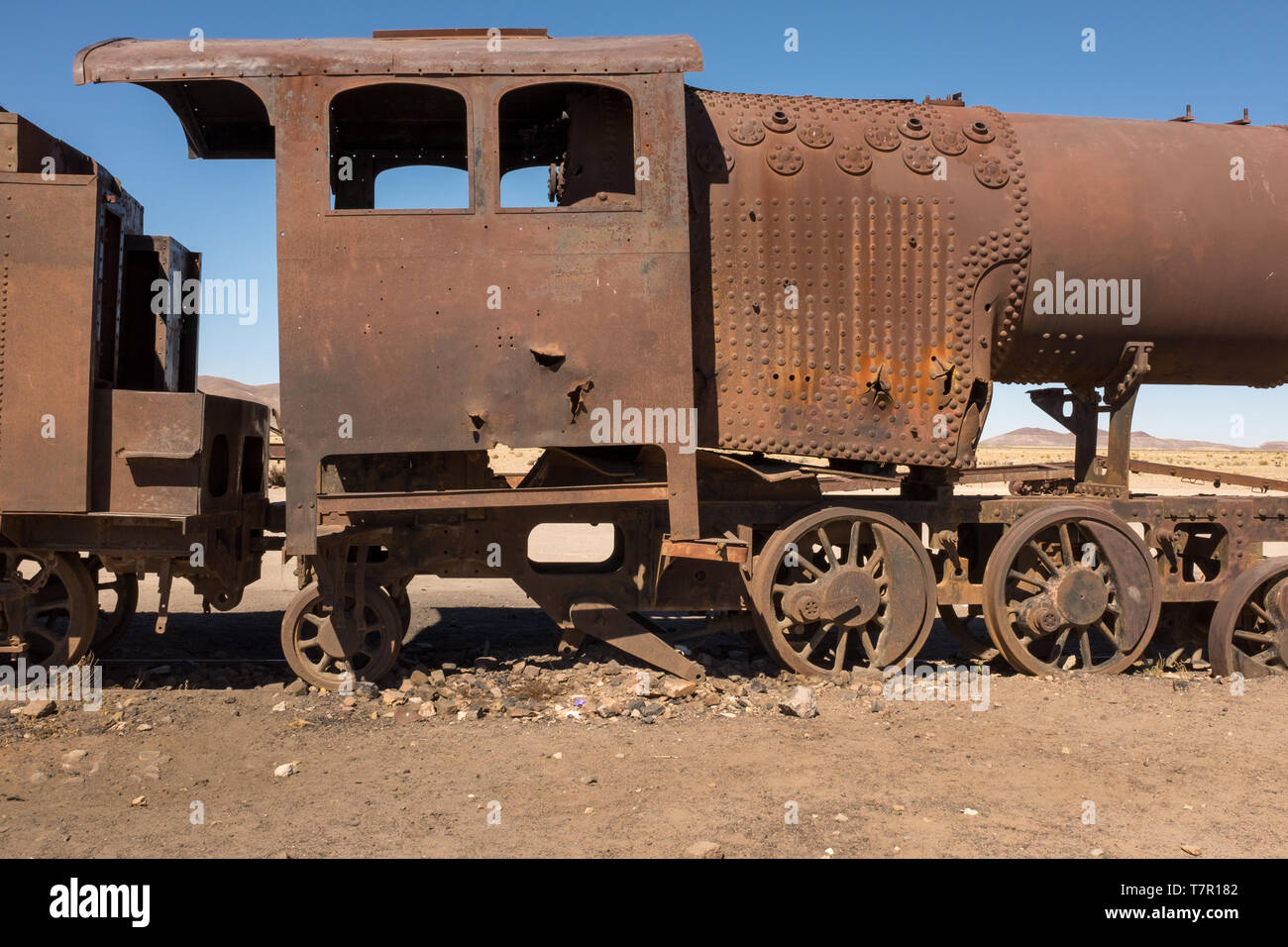 Side view of a rusting steam train as it slowly rots away at the train ...