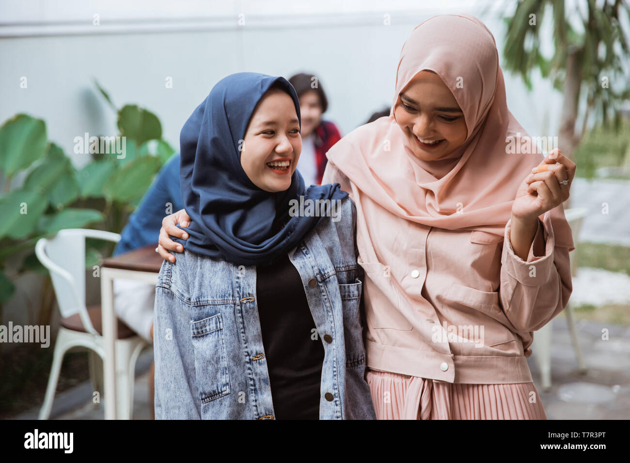 muslim best friend together laughing Stock Photo - Alamy