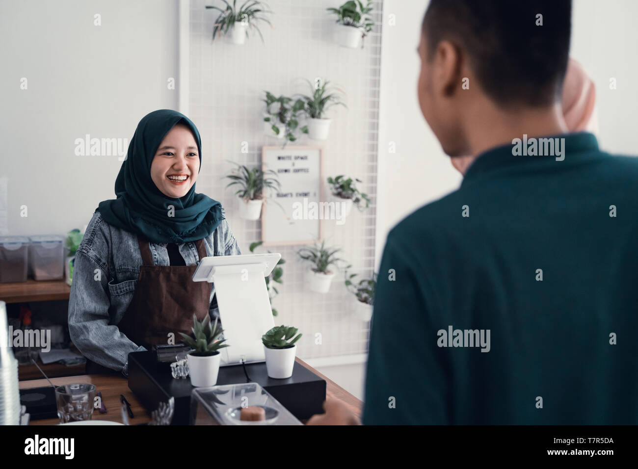 muslim waiter in cafe counter Stock Photo - Alamy