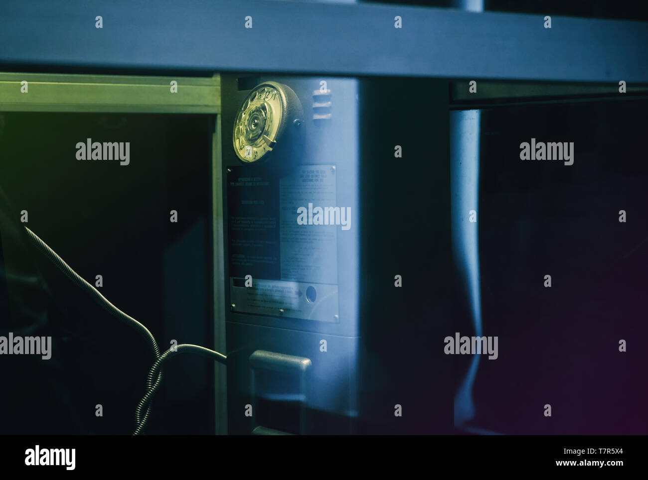 old vintage telephone cabin at night urban 80s mood Stock Photo - Alamy