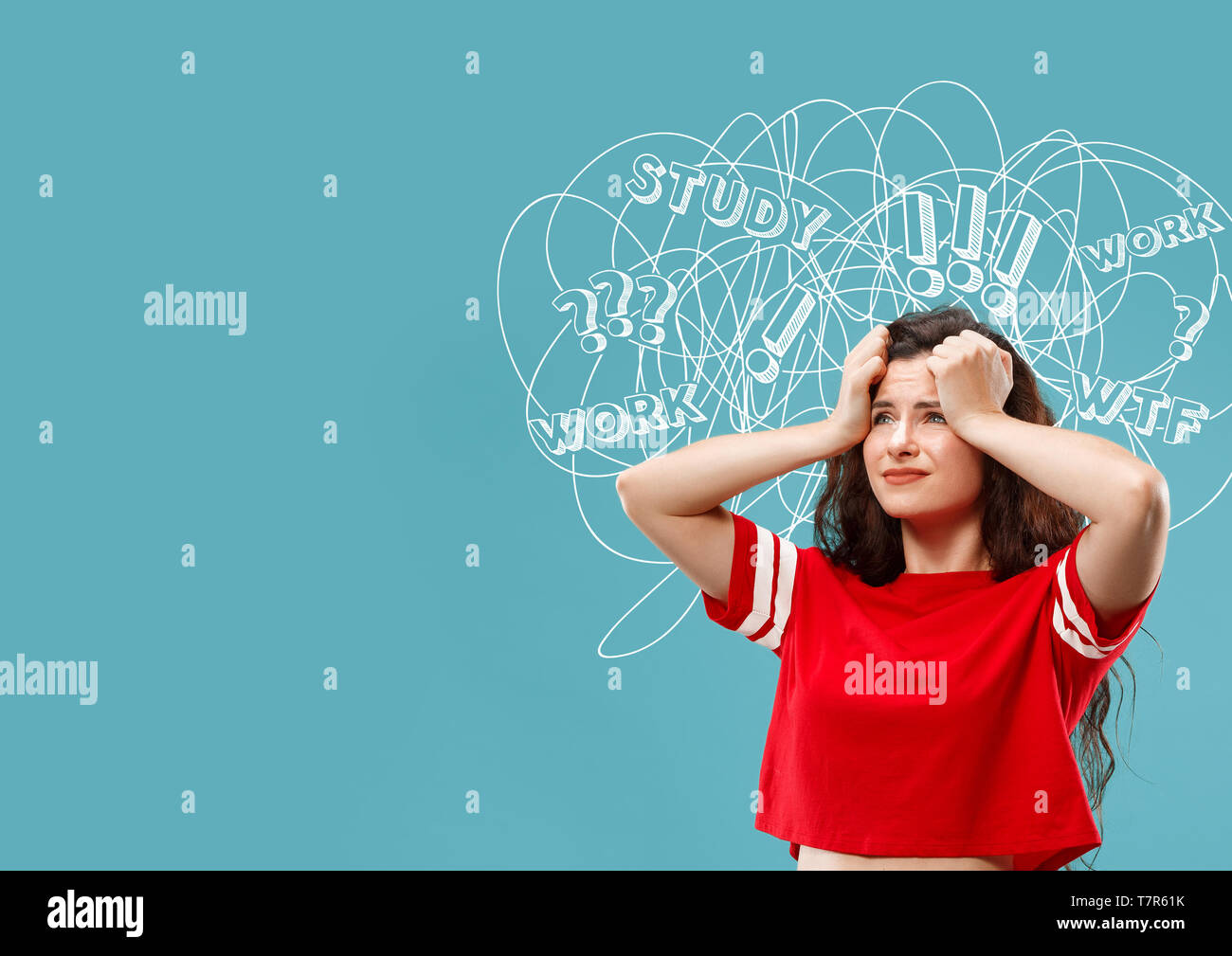 Young caucasian woman with mixed thoughts against blue studio ...