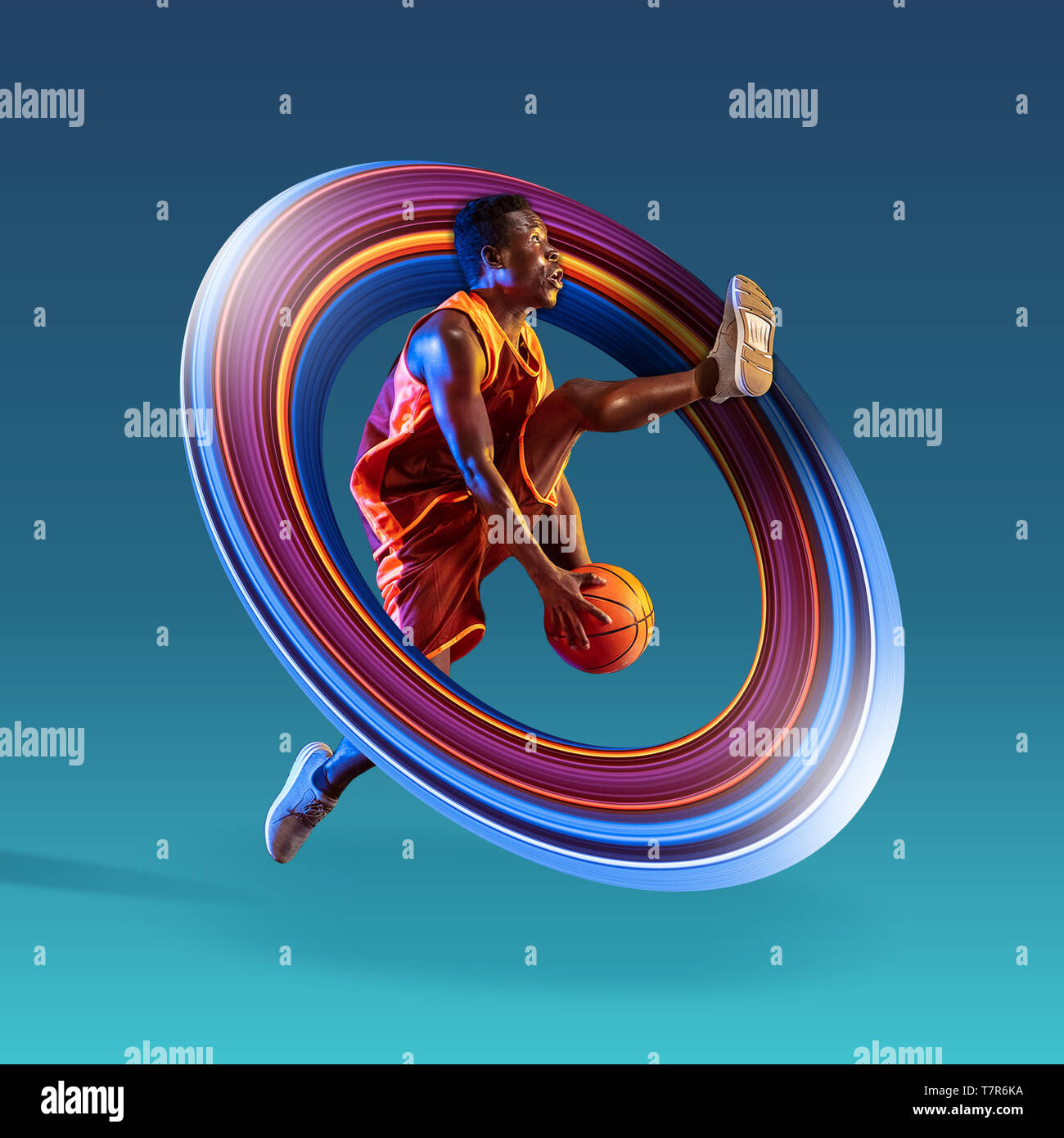 Full length portrait of a basketball player with a ball isolated on ...