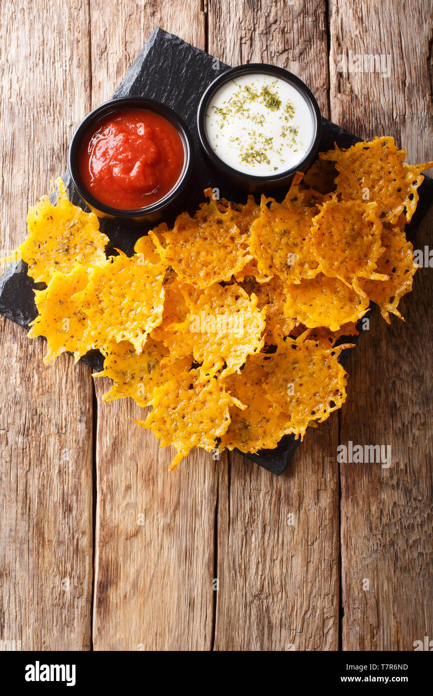 Delicious appetizer of cheddar cheese chips with herbs served with ...