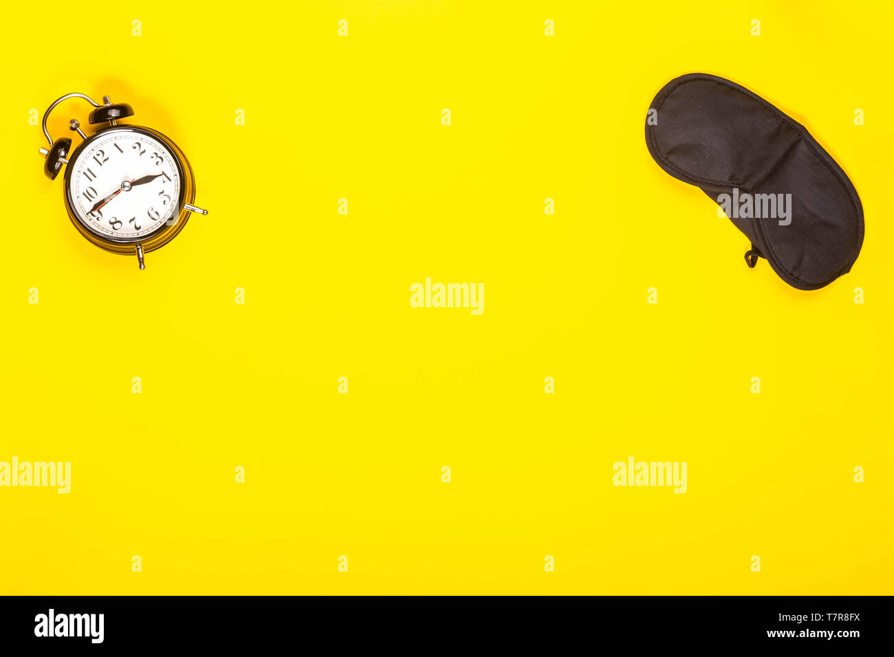 Sleep concept showing an eye mask and alarm clock on a background Stock ...