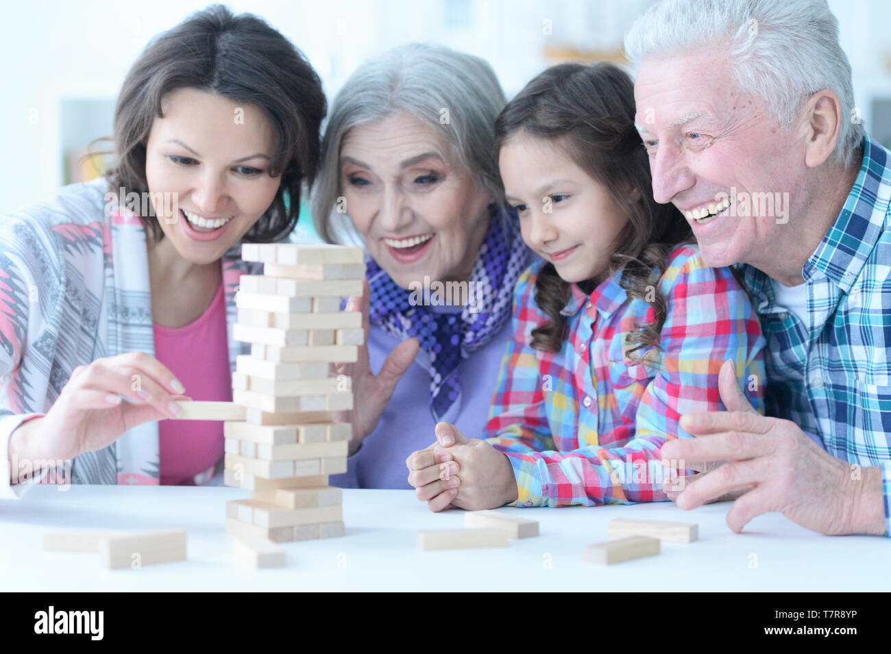 Portrait of big family with cute little girl playing Stock Photo - Alamy