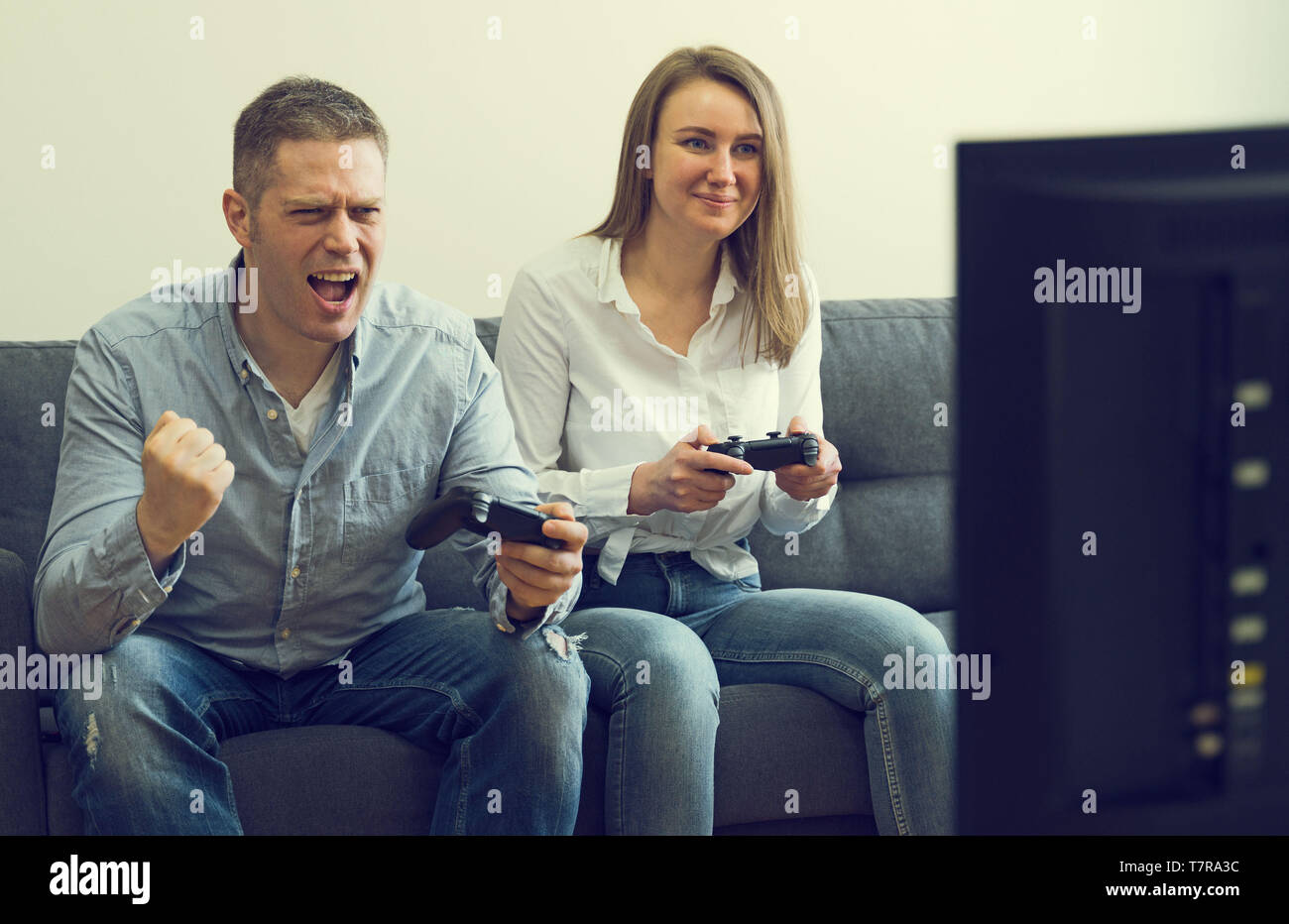 Playing game winning man joystick hi-res stock photography and images ...