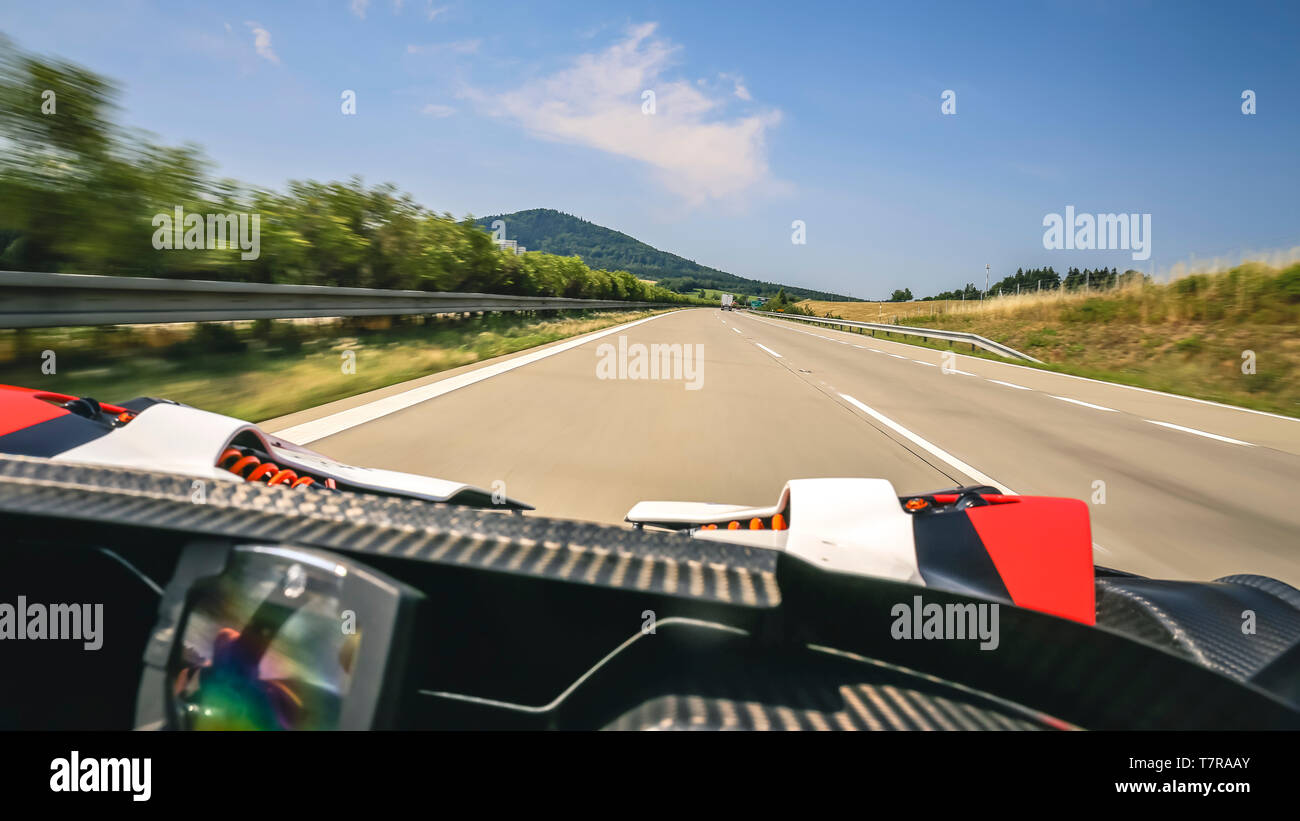 Super fast ride in convertible sportscar on highway Stock Photo - Alamy