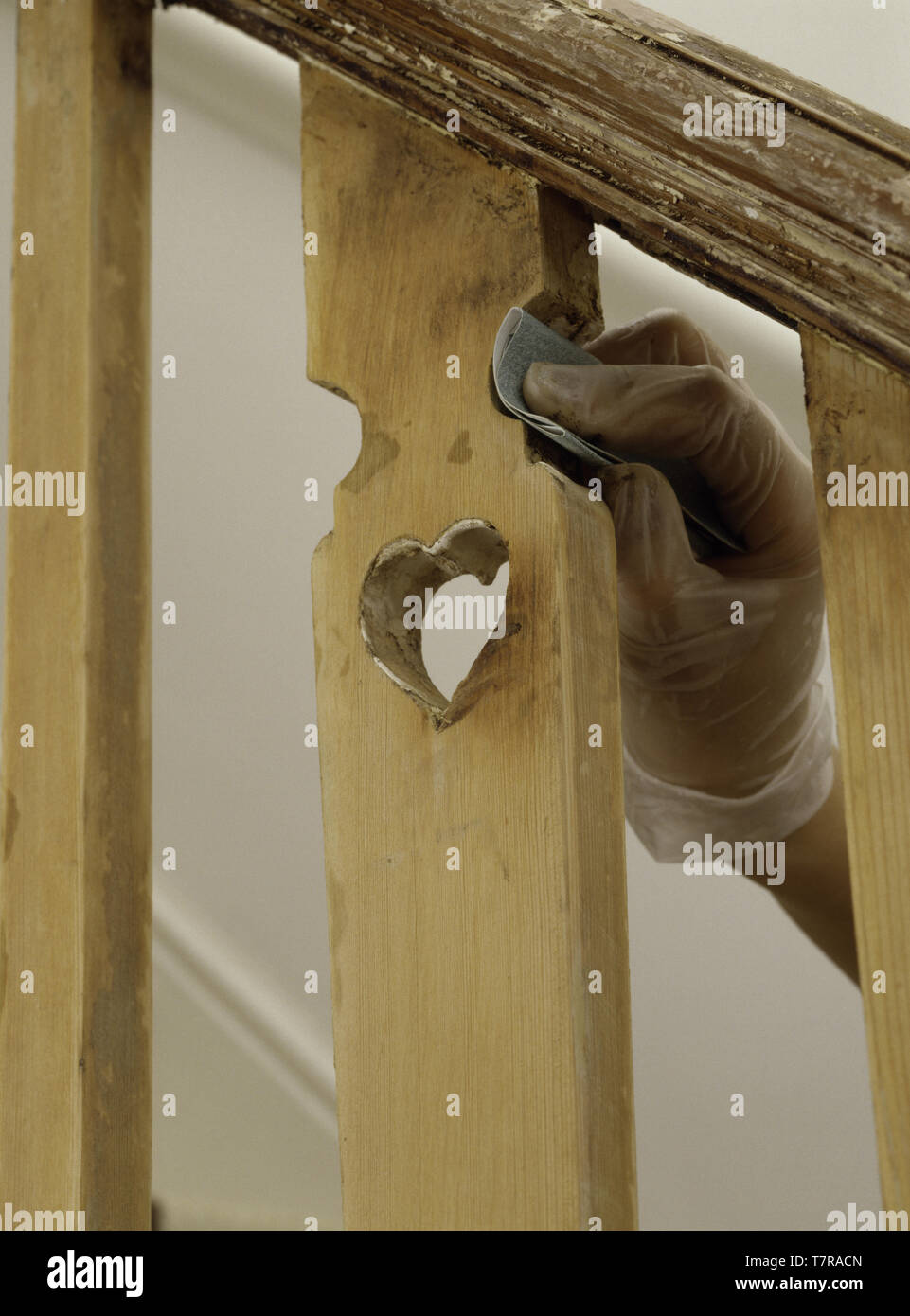 Hand rubbing down wooden banister Stock Photo - Alamy