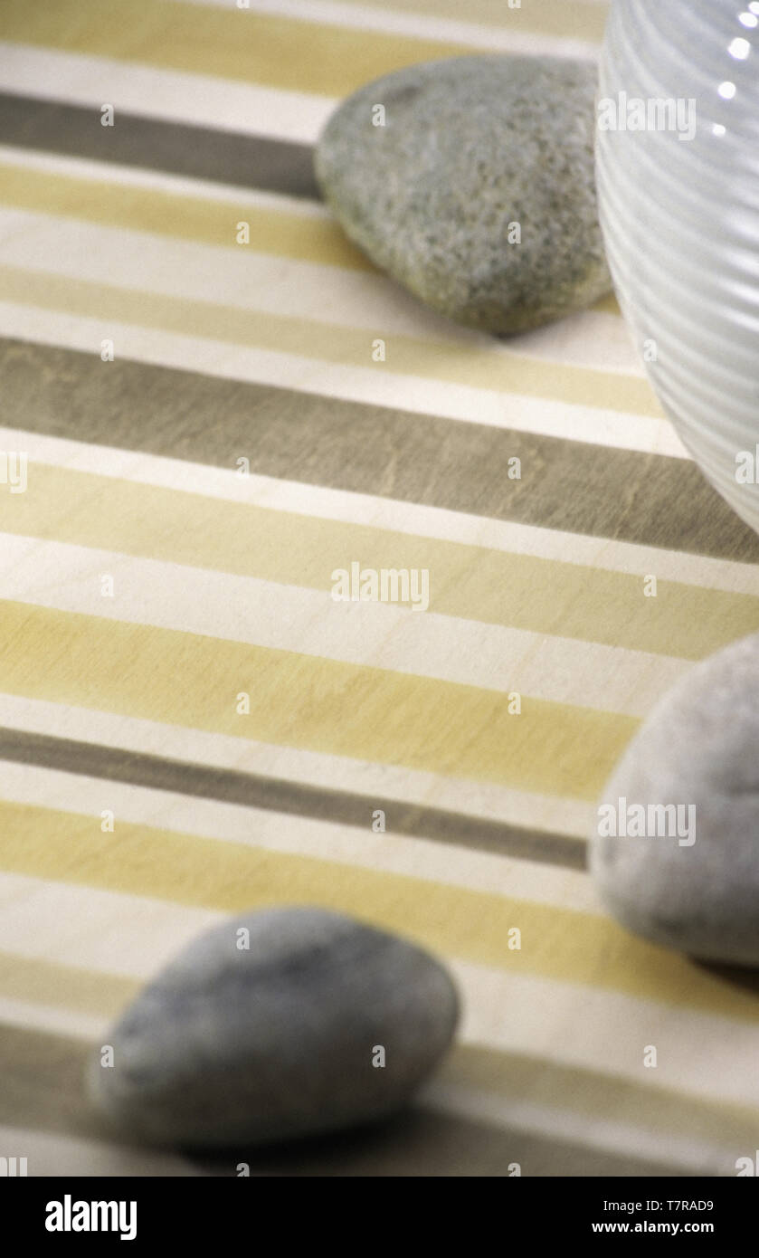 Large pebbles on striped fabric Stock Photo - Alamy