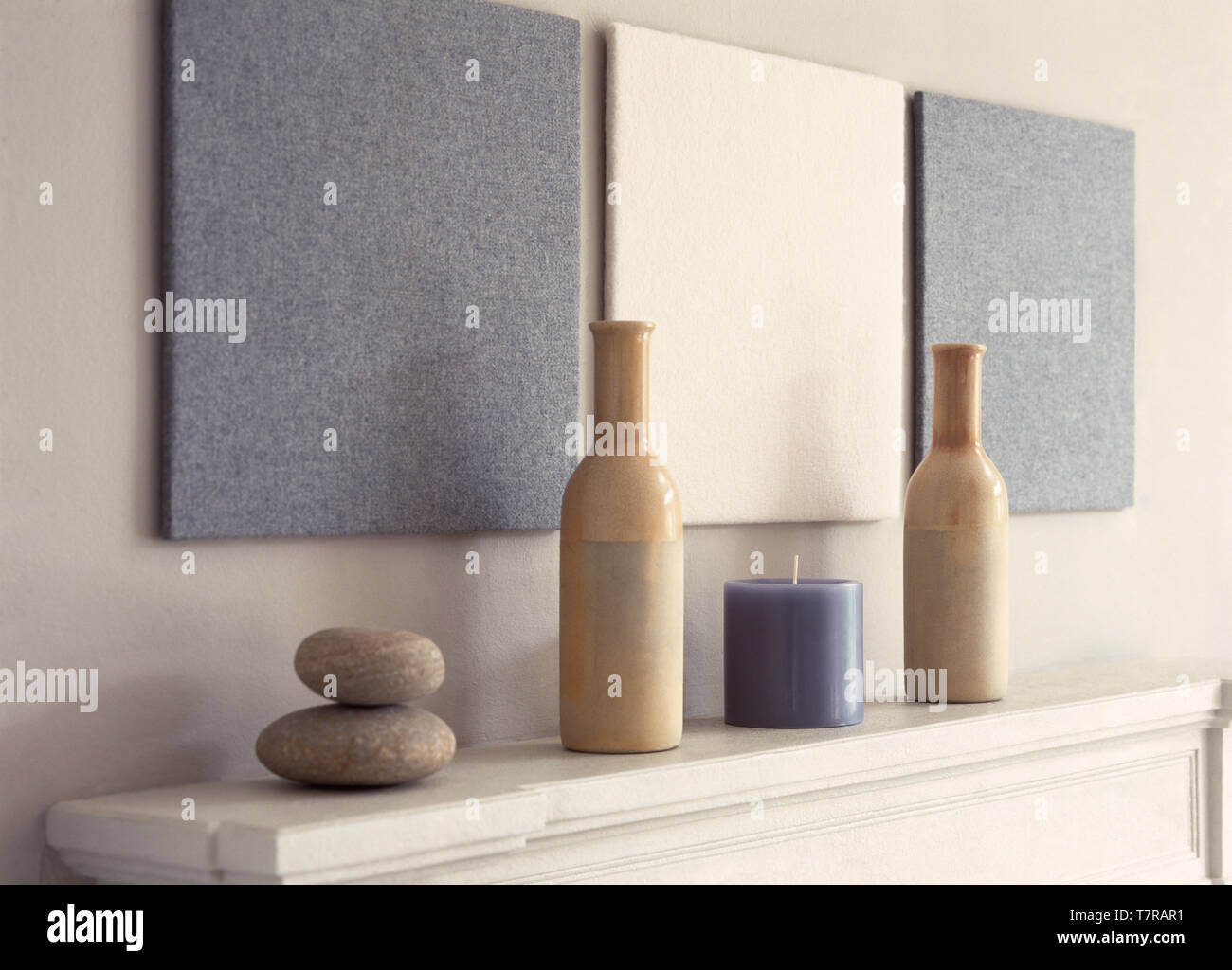 Felt covered panels above ceramic vases on shelf Stock Photo - Alamy