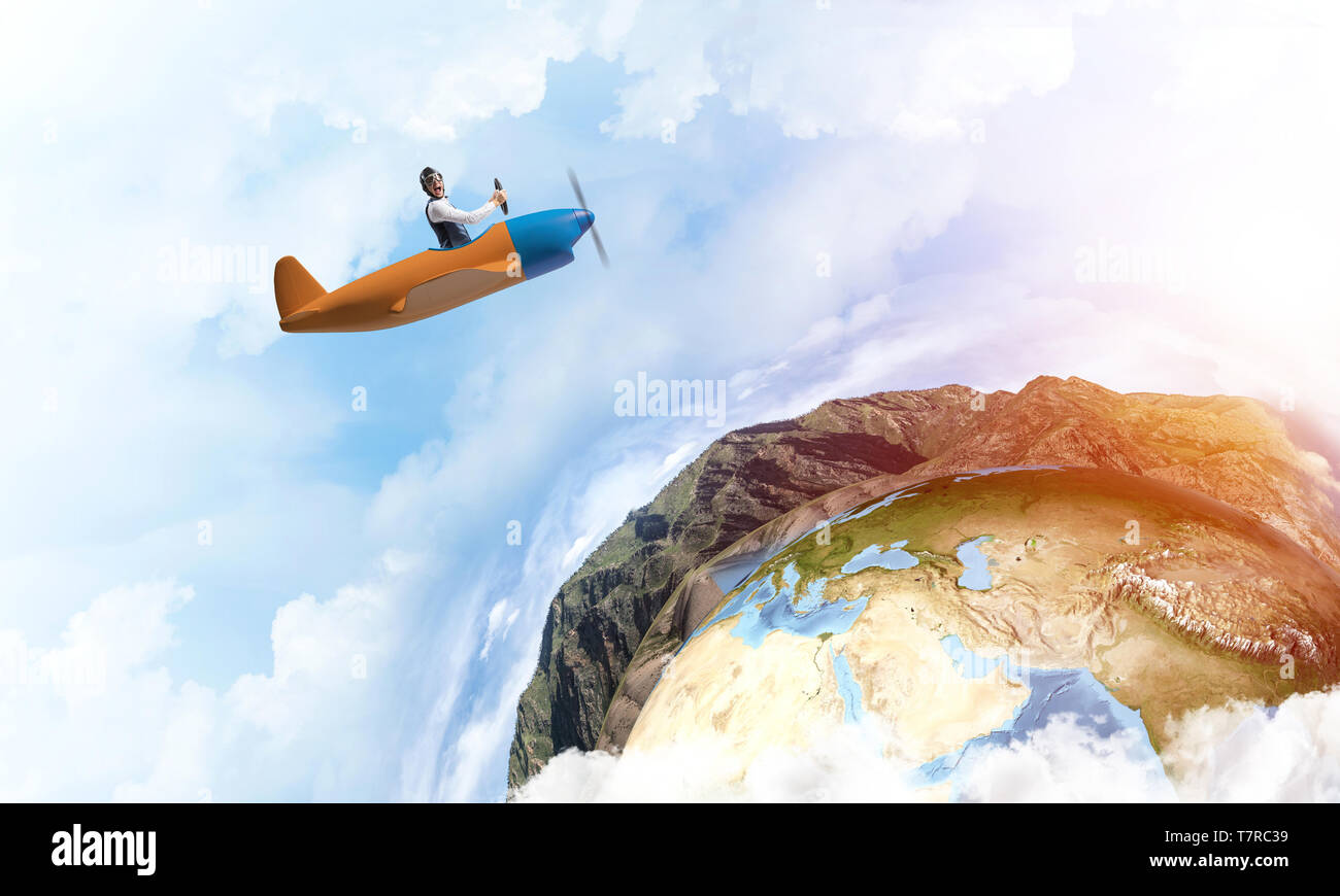 Happy pilot driving small propeller plane Stock Photo - Alamy