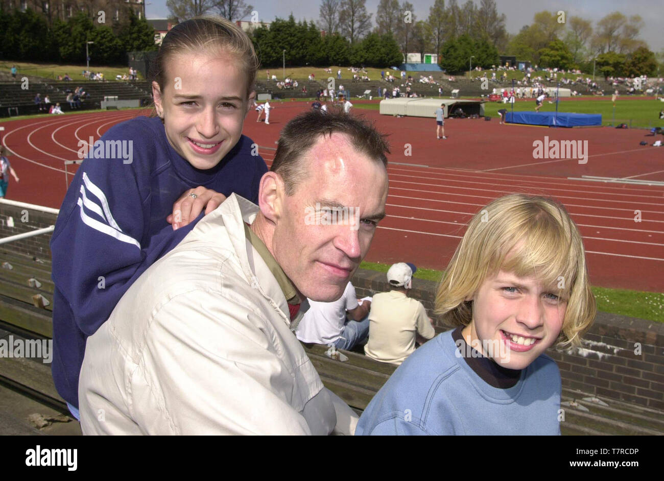 Former athlete Cameron Sharp pictured with his daughters Carly, dark ...