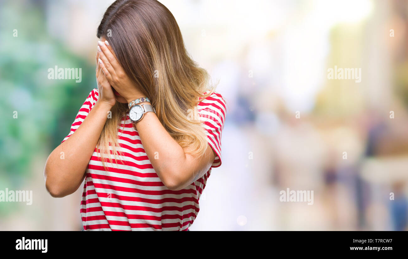 Young beautiful woman casual look over isolated background with sad ...