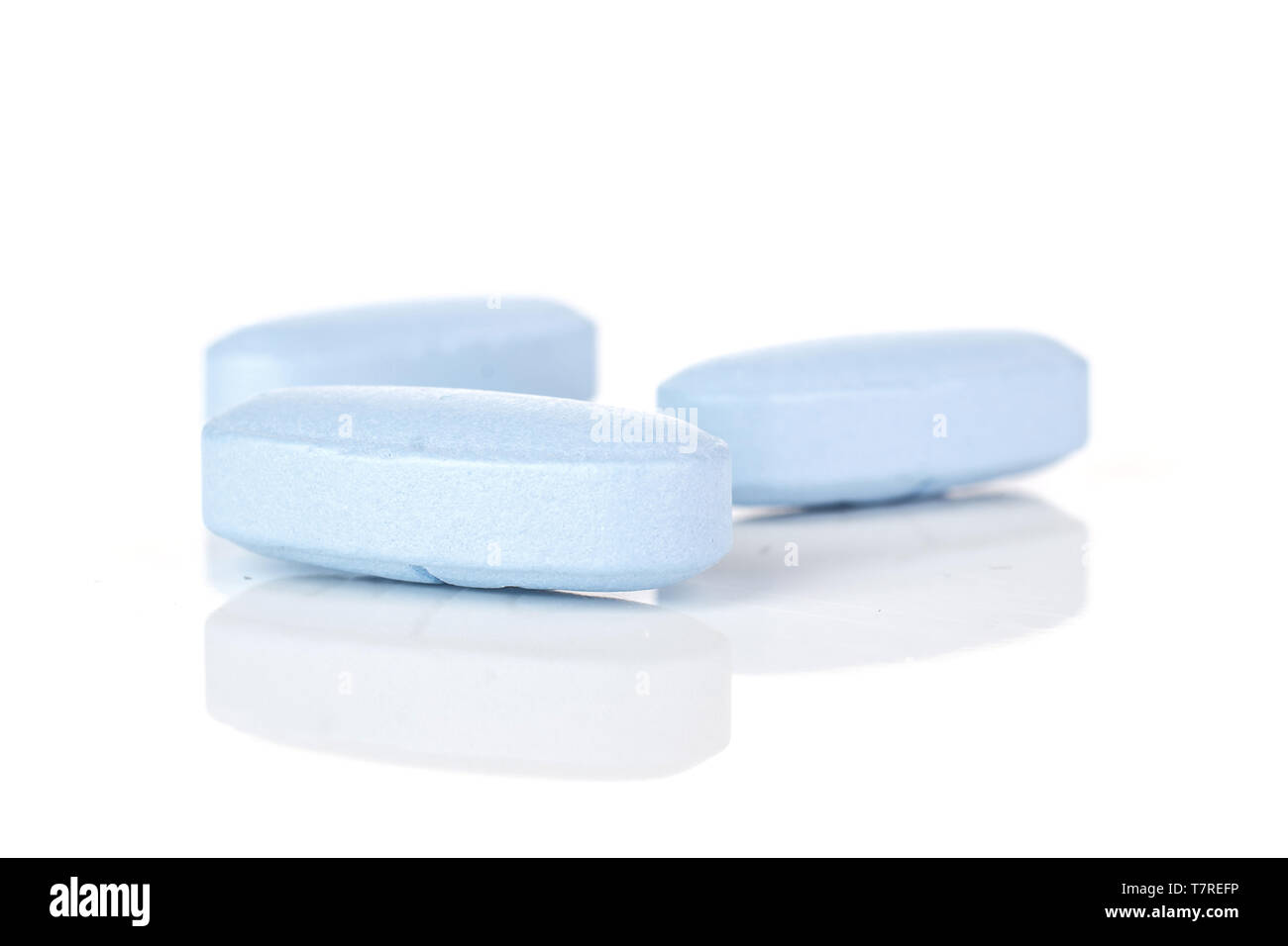 Group of three whole blue medical drug isolated on white background ...