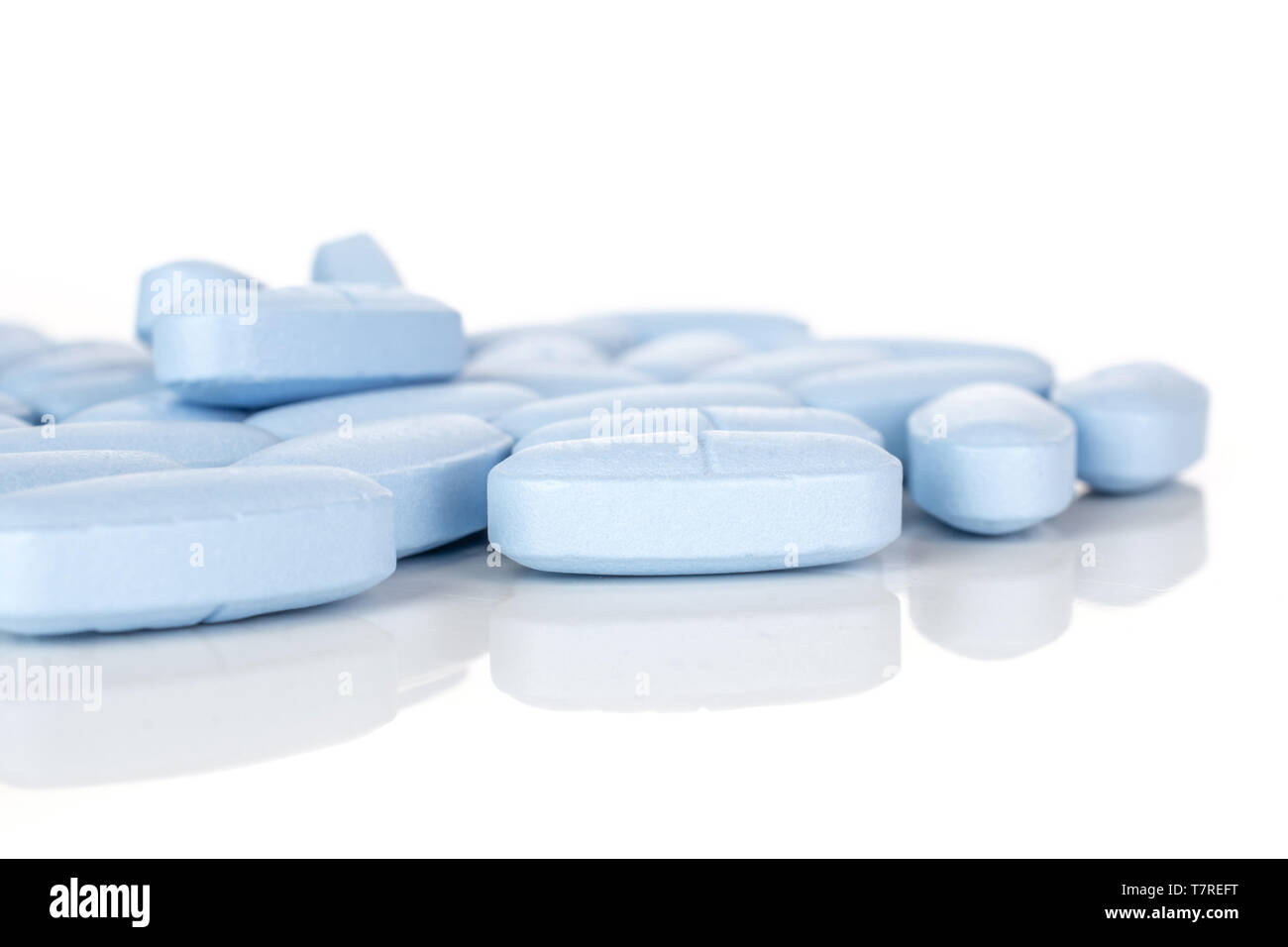 Lot of whole blue medical drug isolated on white background Stock Photo ...