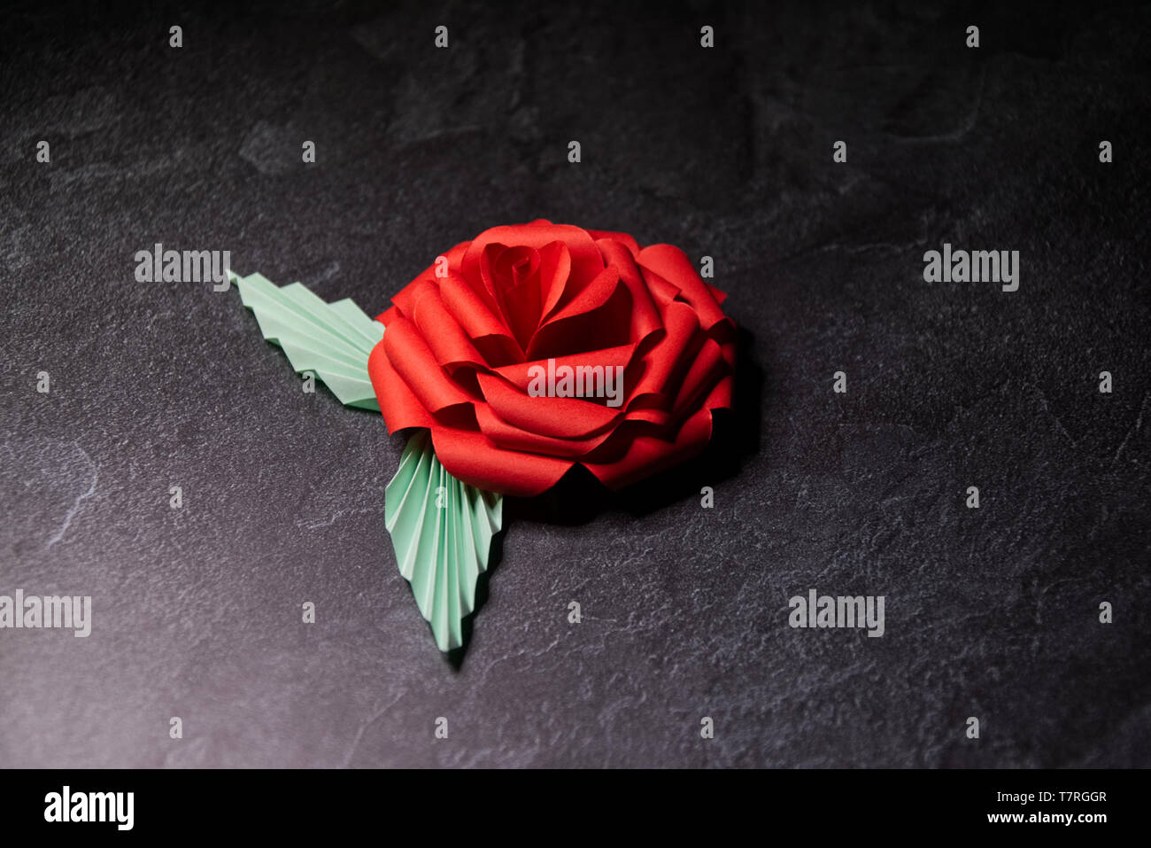 Red Origami Rose Blossom - Paper Art on Textured Background Stock Photo ...