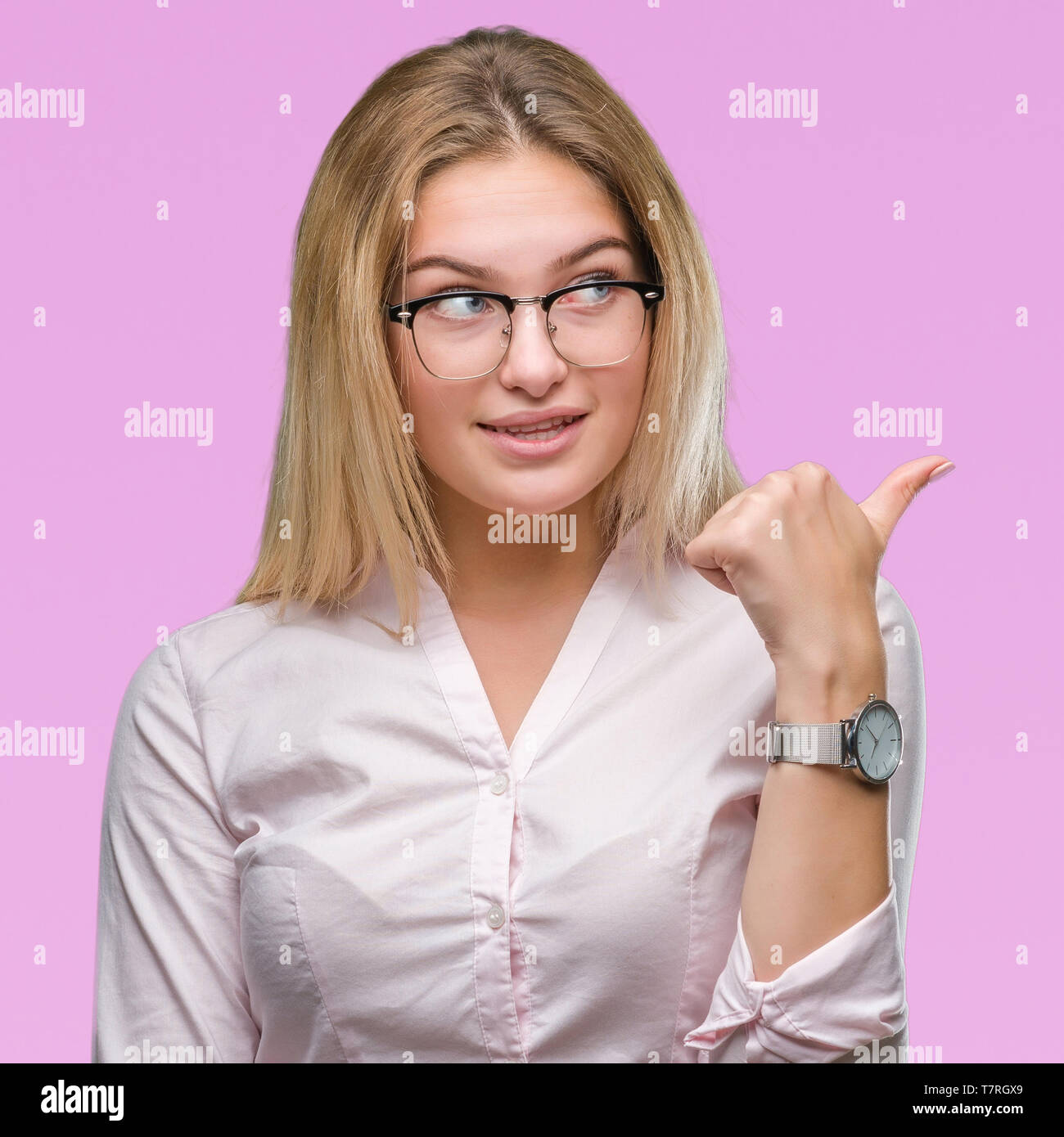 Young caucasian business woman wearing glasses over isolated background ...