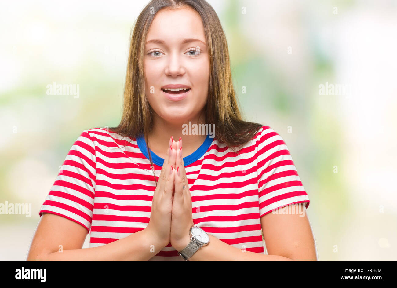 Young caucasian beautiful woman over isolated background begging and ...