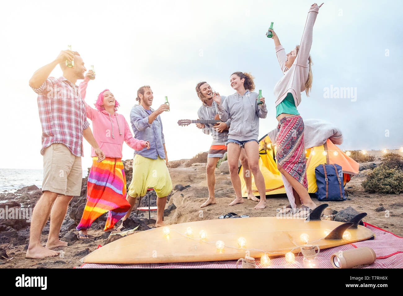 Group of young people having fun on the beach hi-res stock photography ...