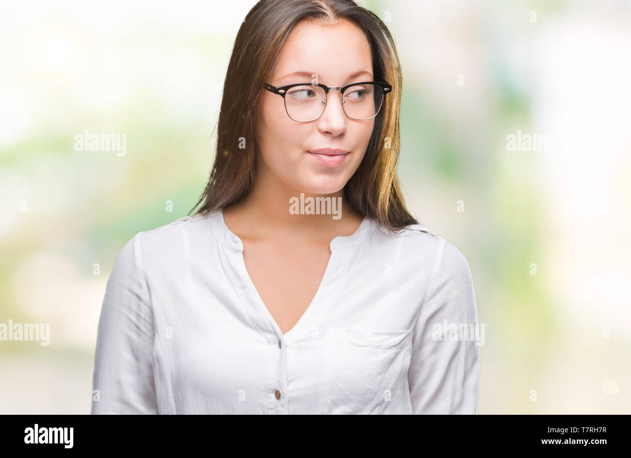 Young caucasian beautiful business woman wearing glasses over isolated ...