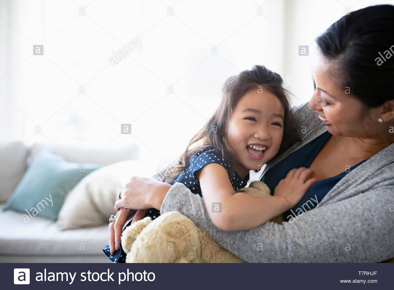 Happy mother and daughter hugging hi-res stock photography and images - Alamy