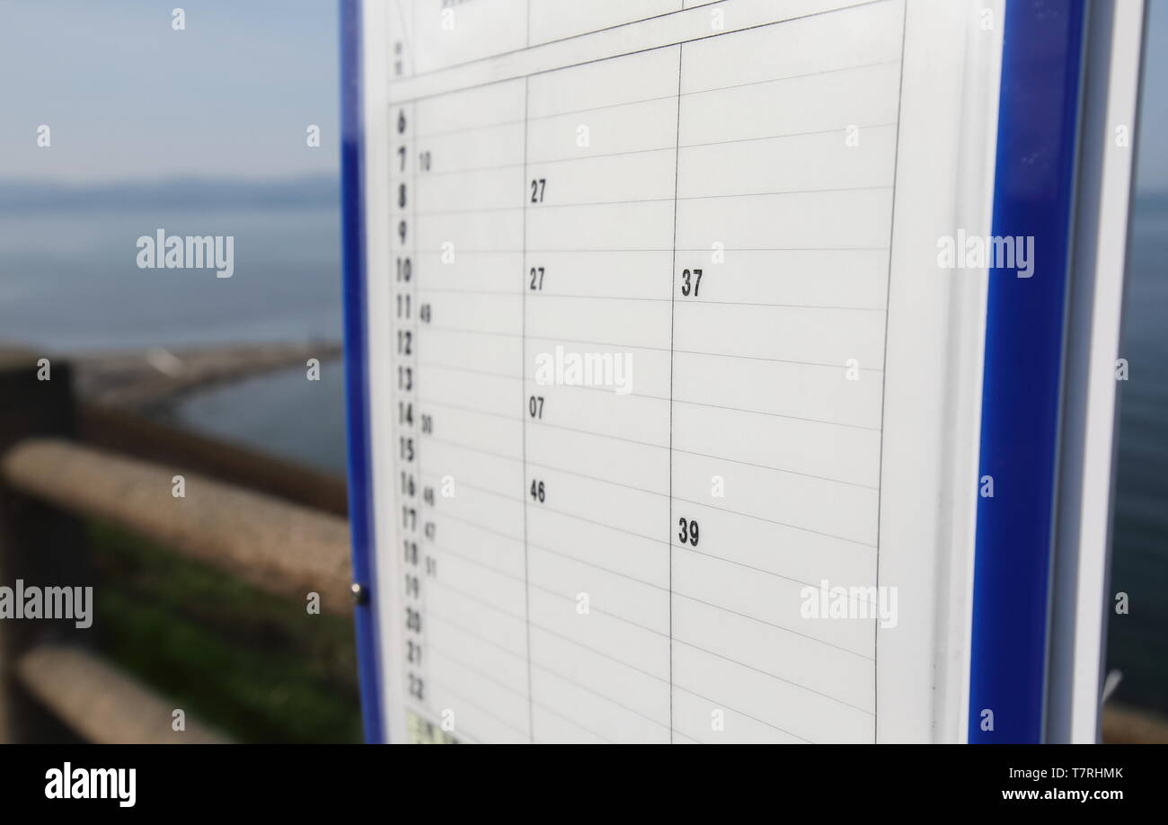 Low frequency Bus timetable public transport in countryside Stock Photo ...