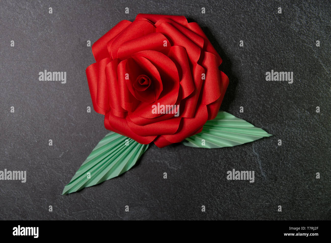 Red Origami Rose Blossom - Paper Art on Textured Background Stock Photo ...