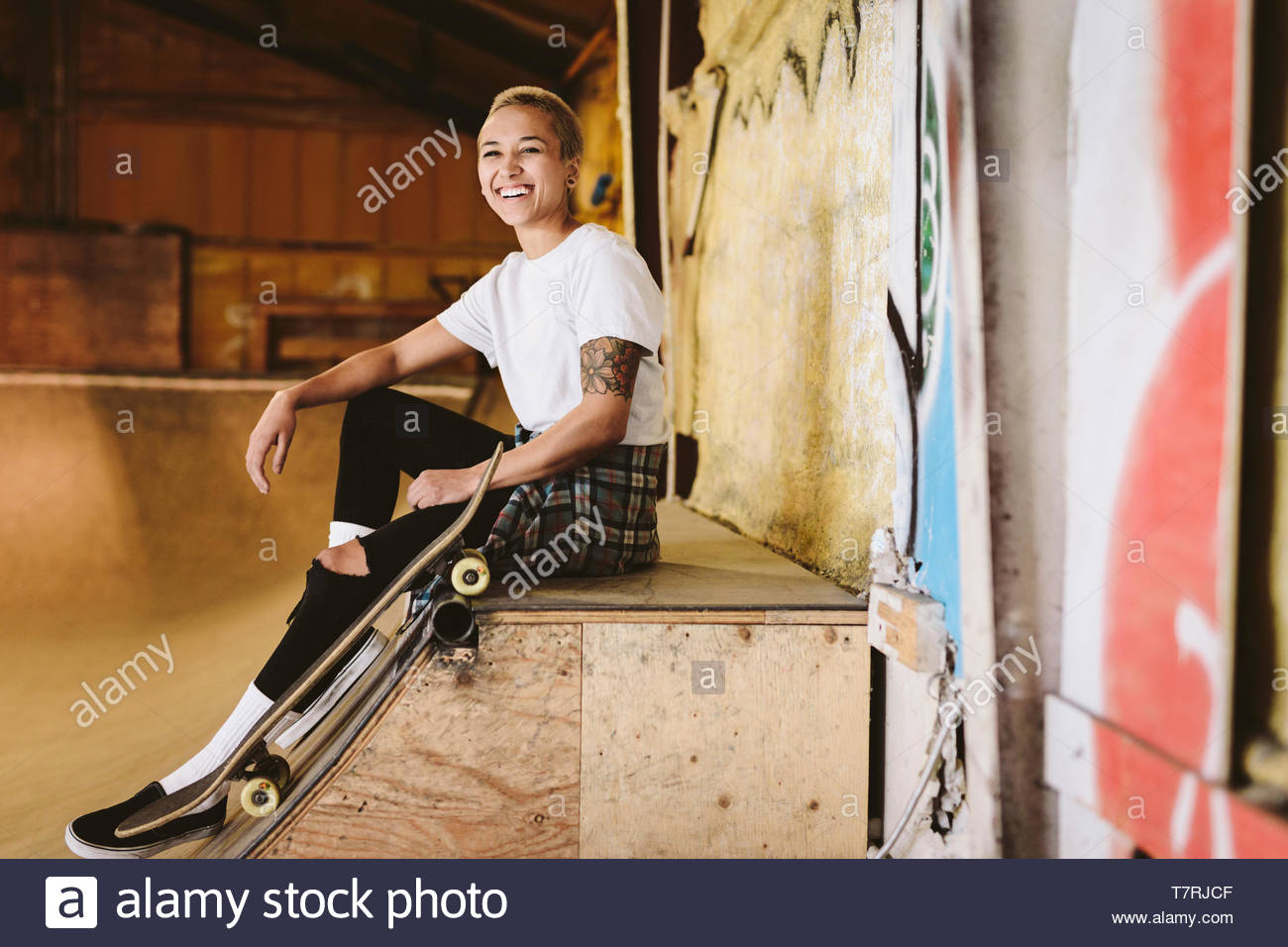 Skateboarder Sitting On Ramp Stock Photos & Skateboarder Sitting On ...