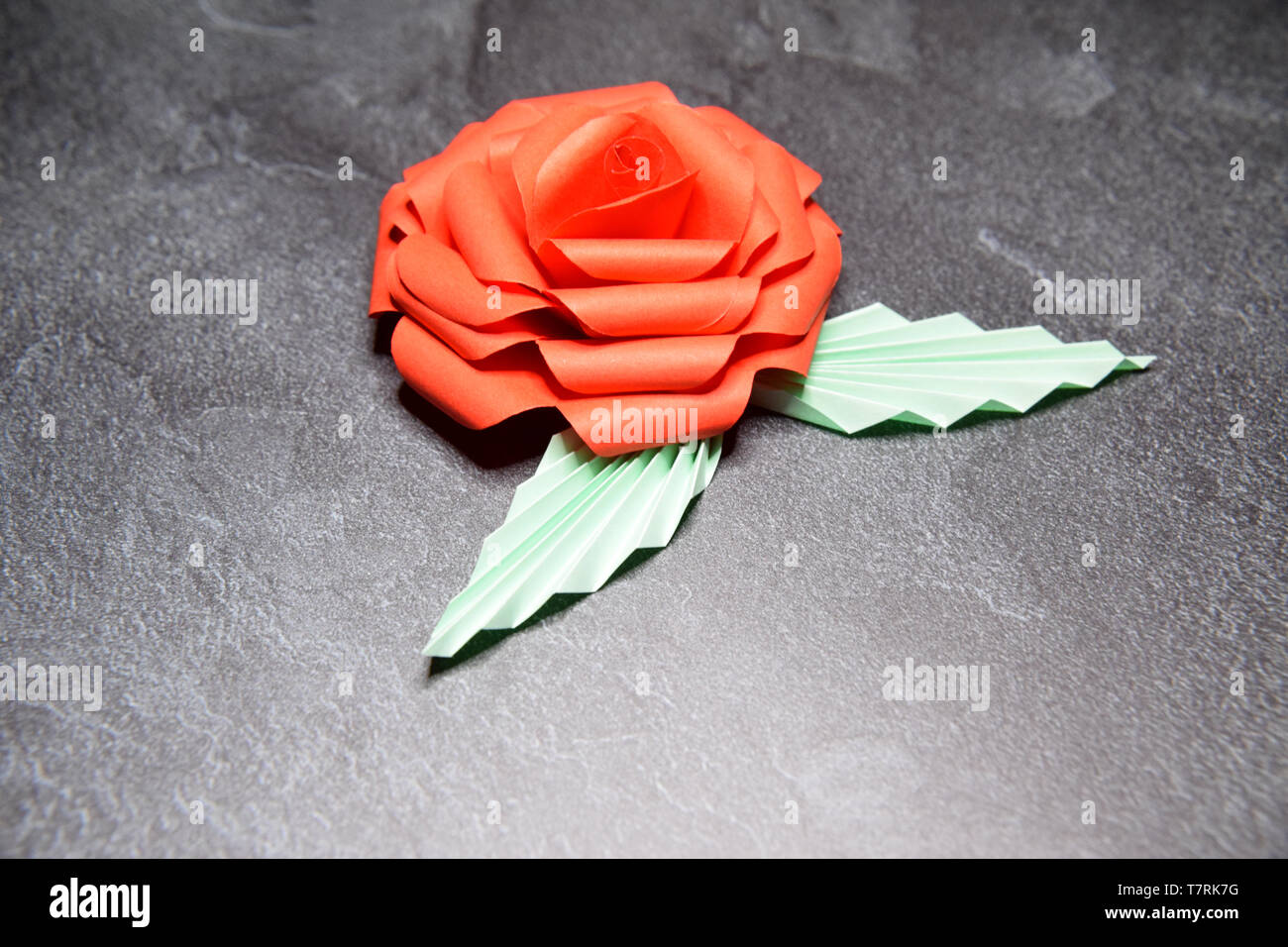 Red Origami Rose Blossom - Paper Art on Textured Background Stock Photo ...