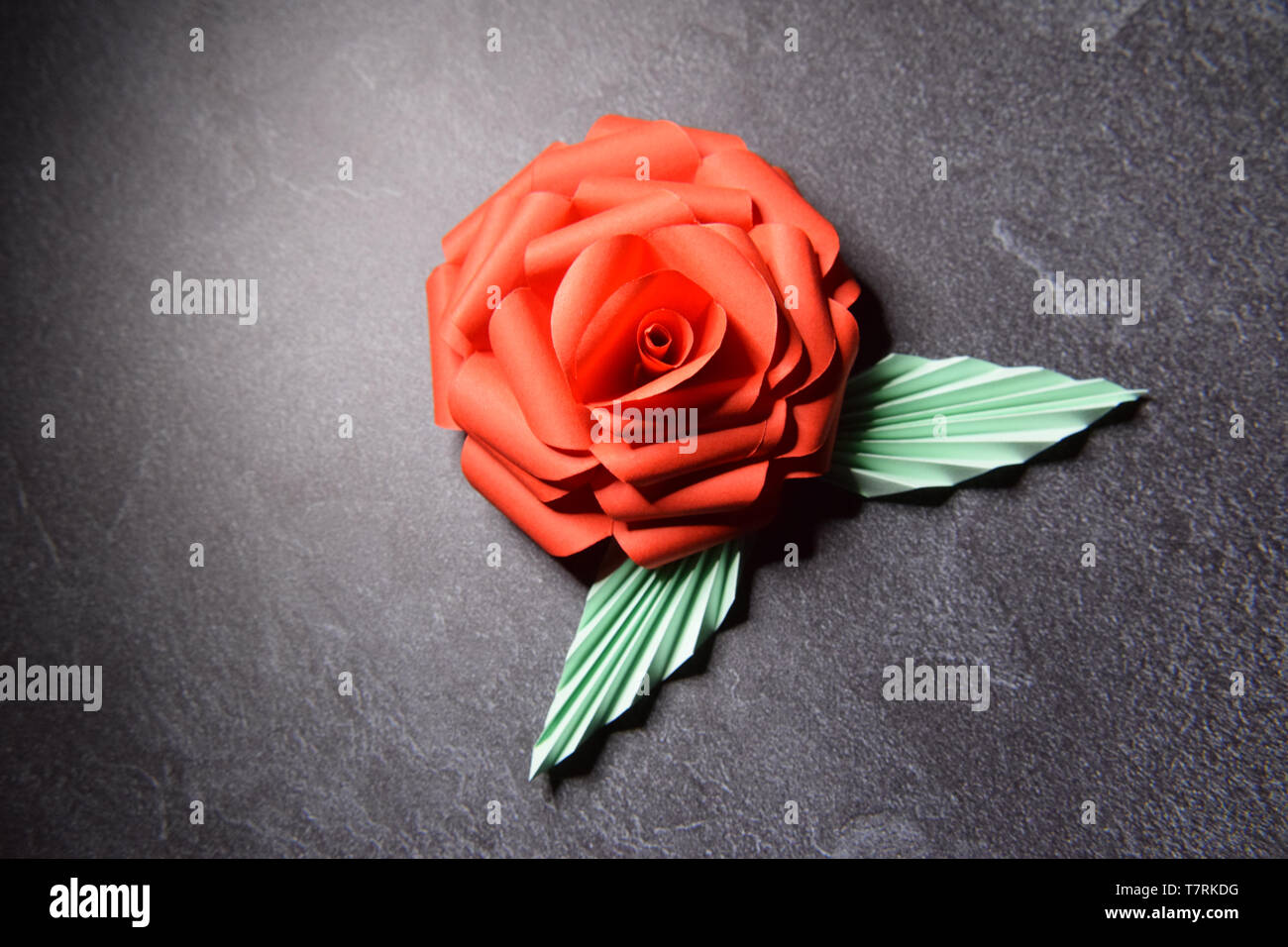 Red Origami Rose Blossom - Paper Art on Textured Background Stock Photo ...