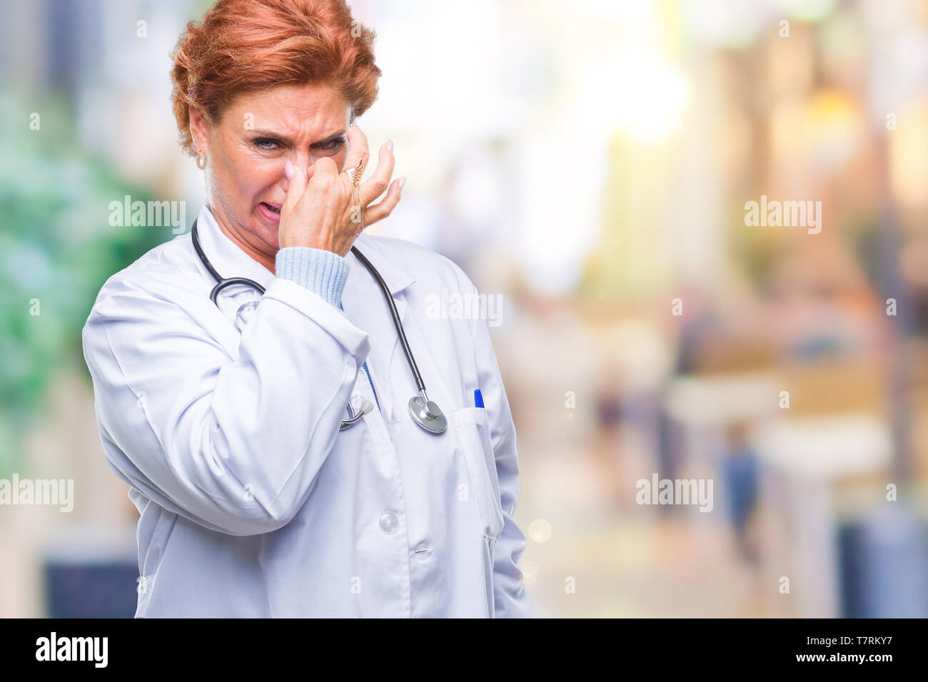 Senior caucasian doctor woman wearing medical uniform over isolated ...