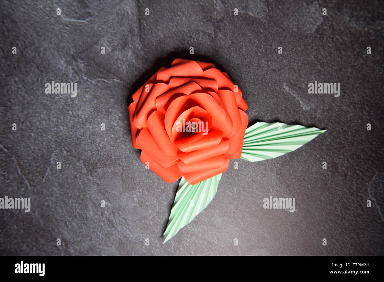 Red Origami Rose Blossom - Paper Art on Textured Background Stock Photo ...