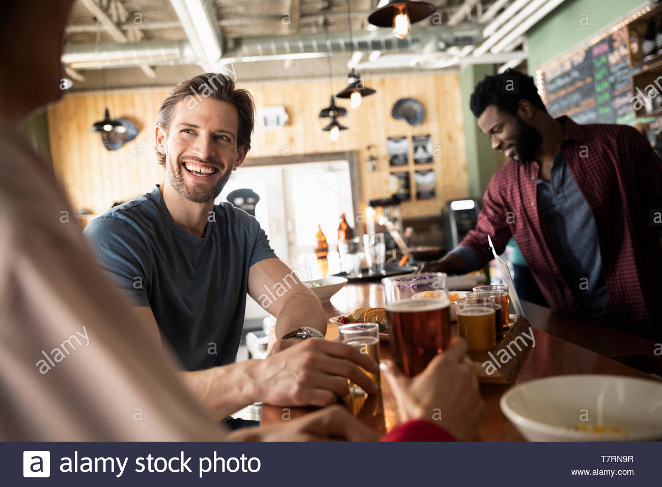 Man sitting in a pub drinking a pint of beer hi-res stock photography ...