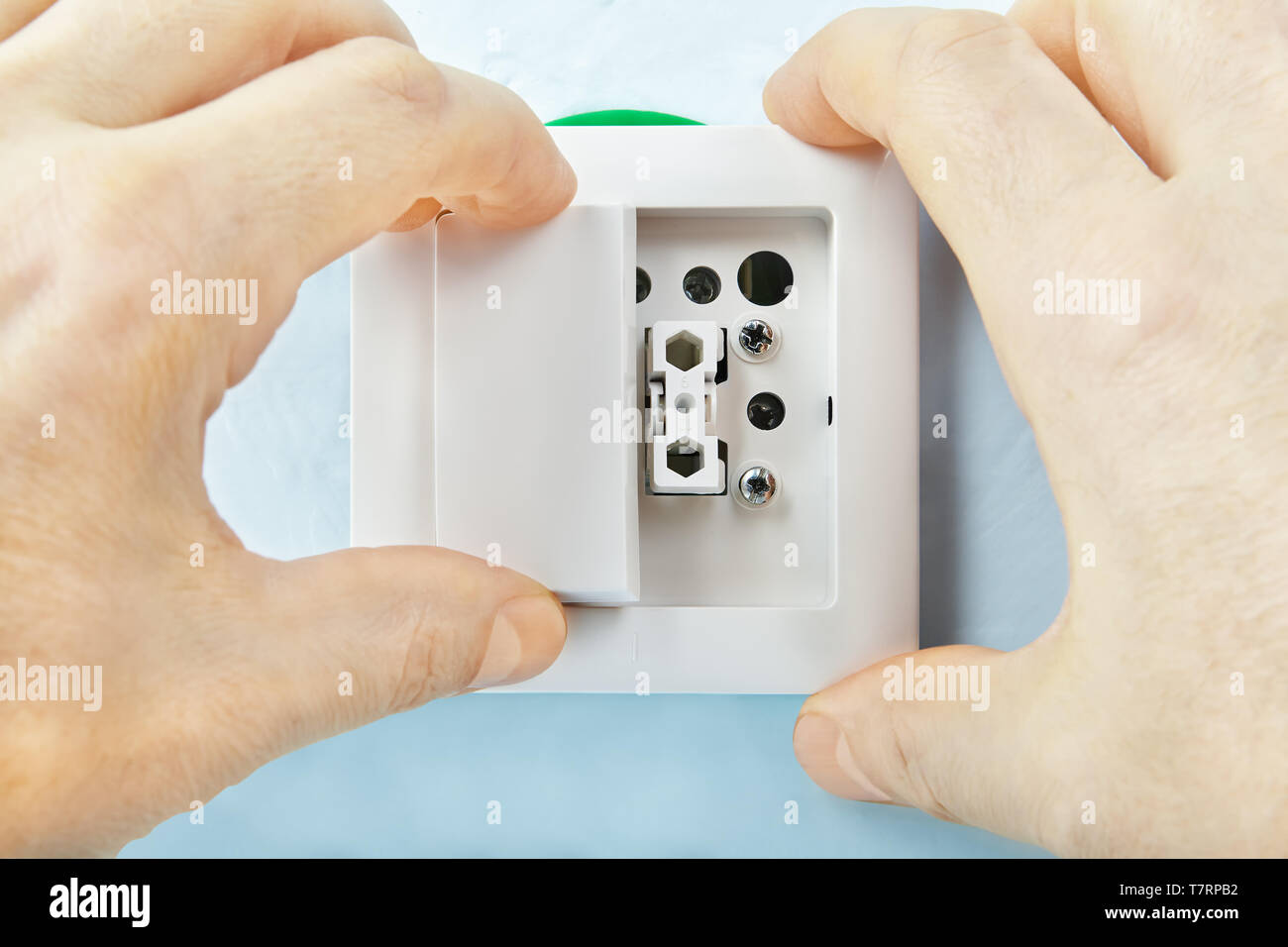 Worker is putting button on european standard push button, electrical ...