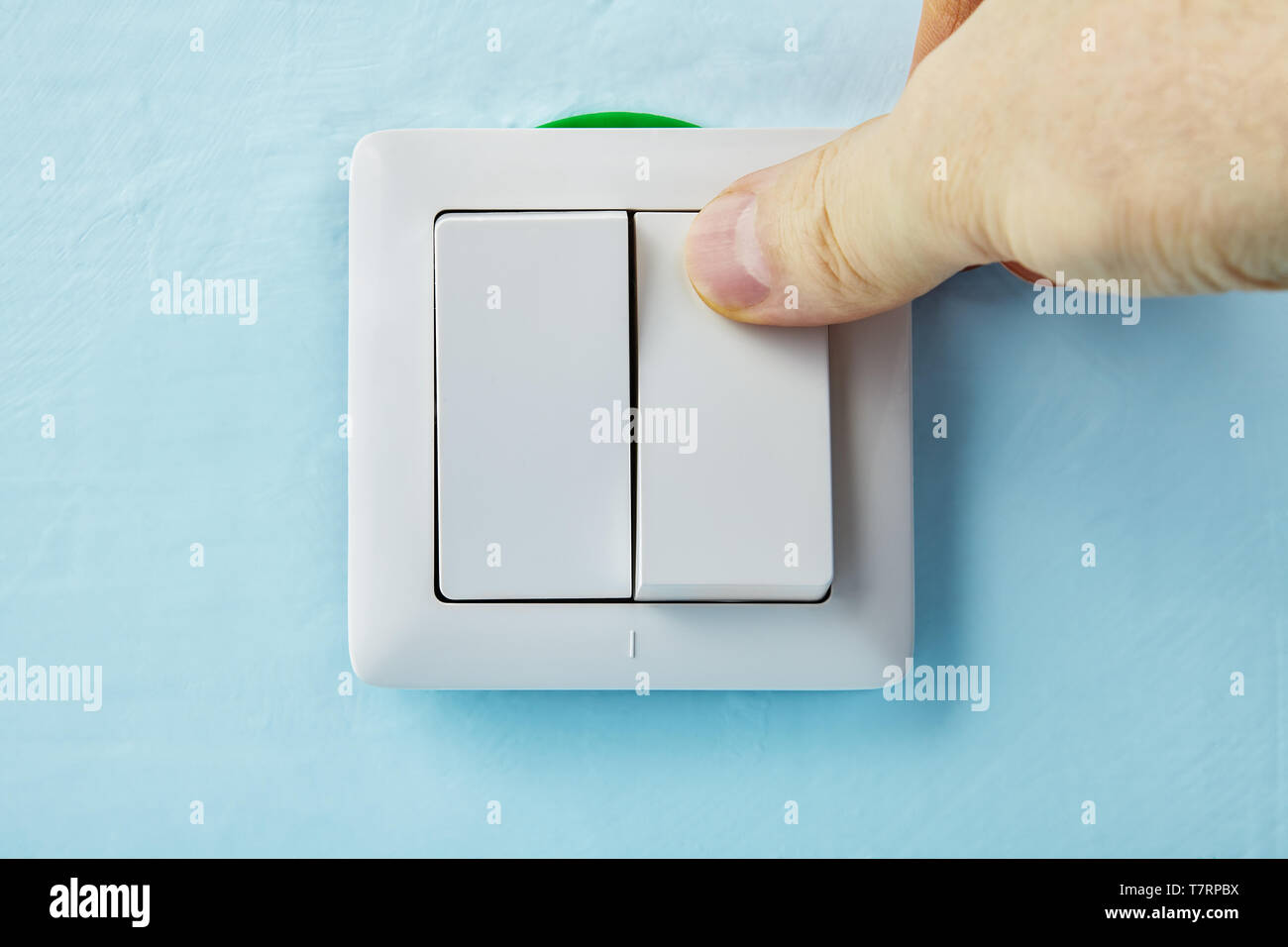Repairman is pressing the button of new european standard push button ...